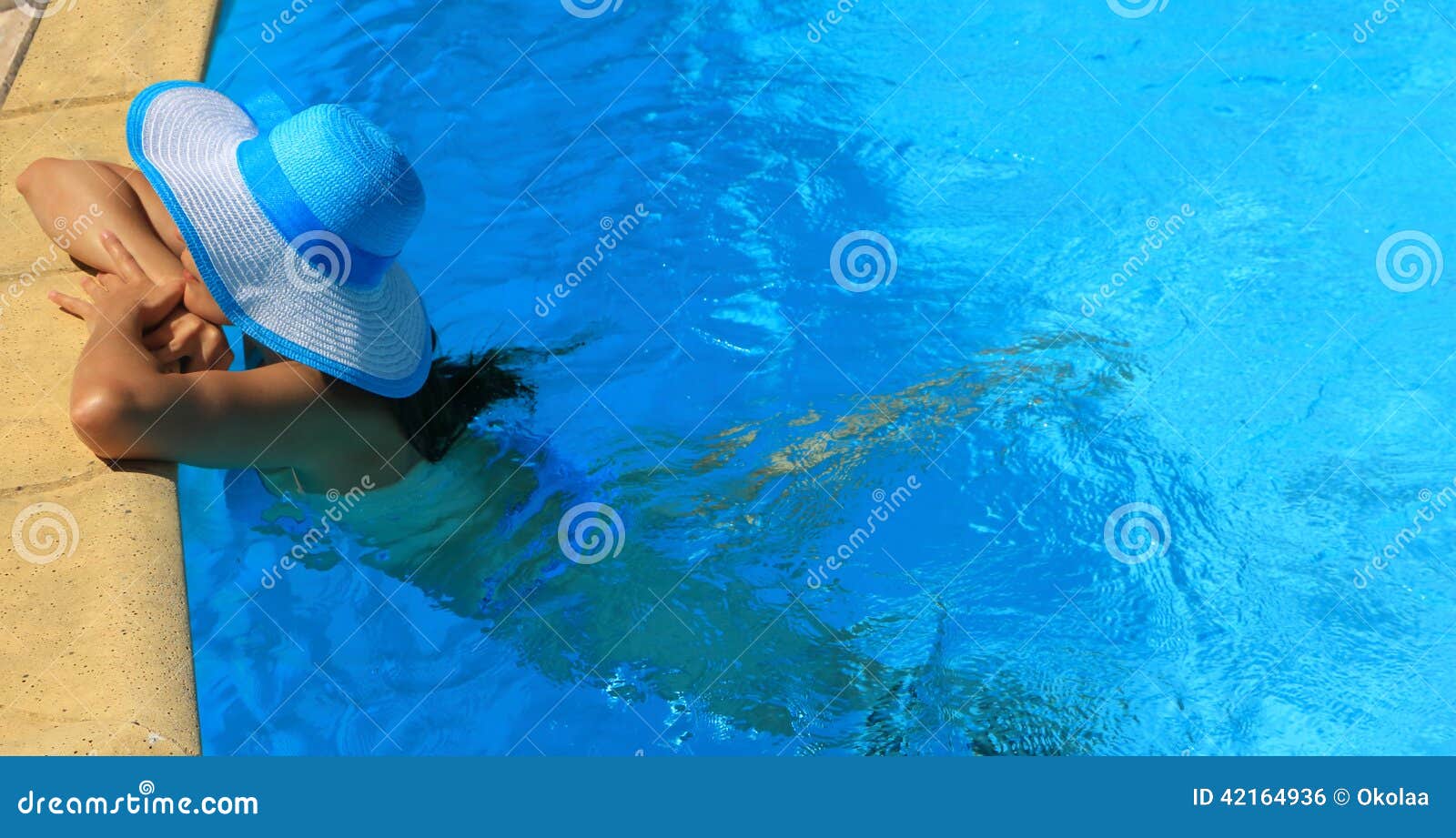 Young lady by the poolside stock photo. Image of recreational - 42164936