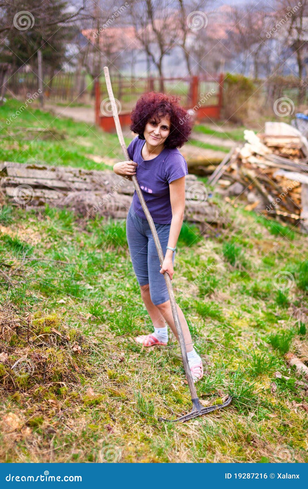 Young Lady with Rake Spring Cleaning the Garden Stock Photo - Image of ...