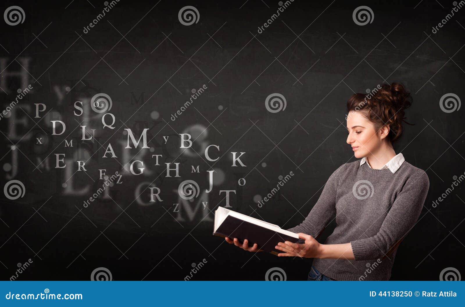 Young Lady Reading a Book with Alphabet Letters Stock Photo - Image of ...