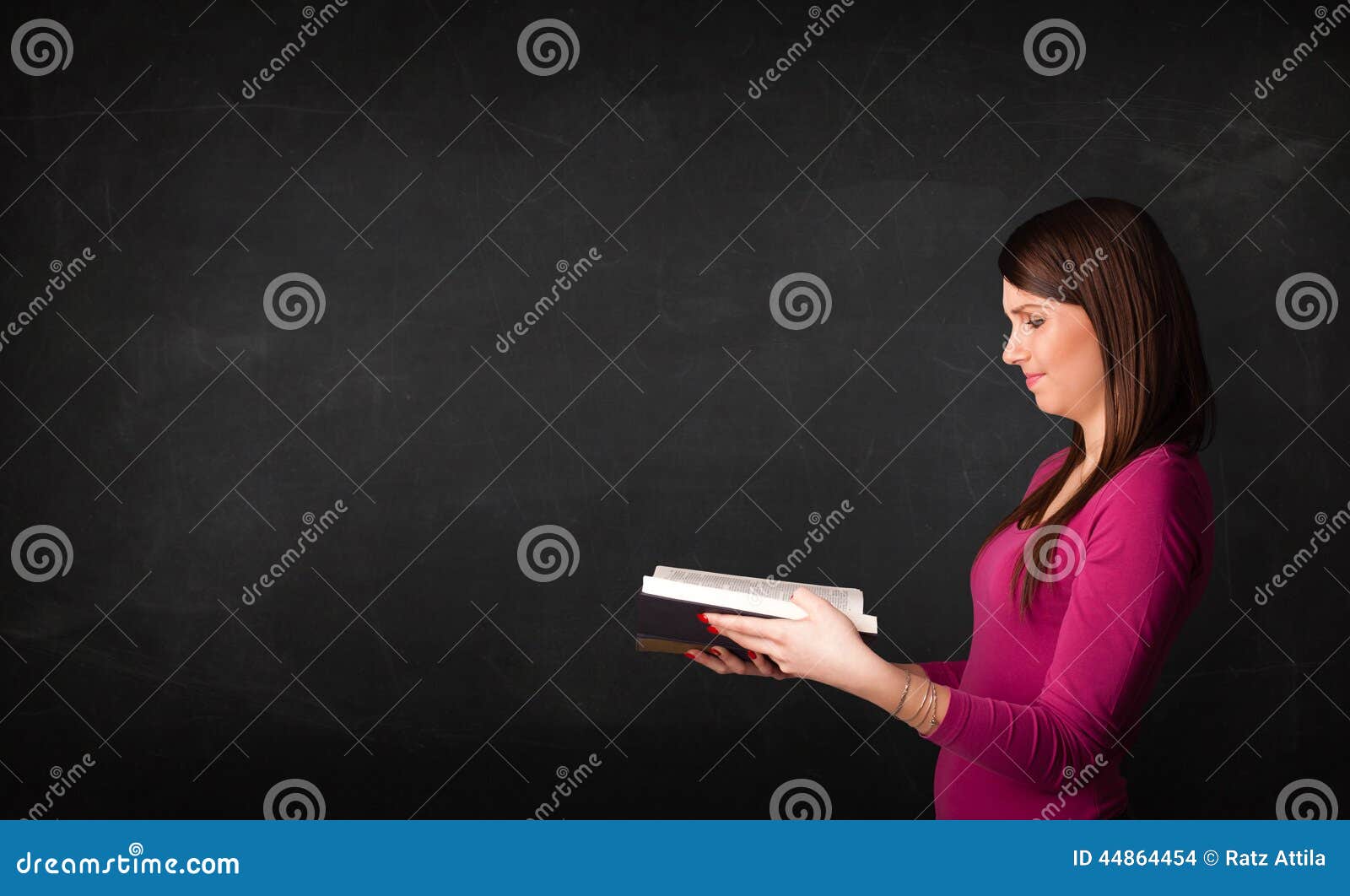 Young lady reading a book stock photo. Image of exam - 44864454