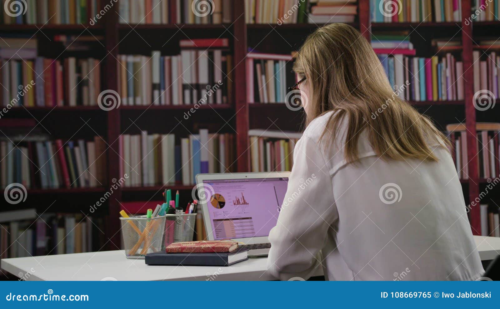Young Lady Using a Laptop in the Library Stock Image - Image of book ...