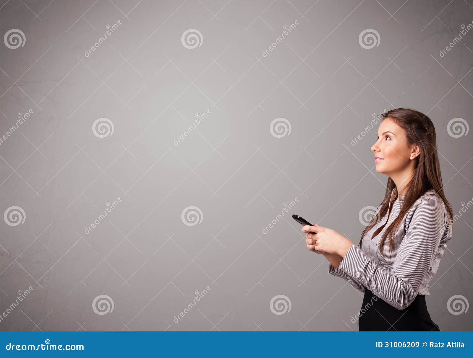Young Lady Standing and Holding a Phone with Copy Space Stock Image ...