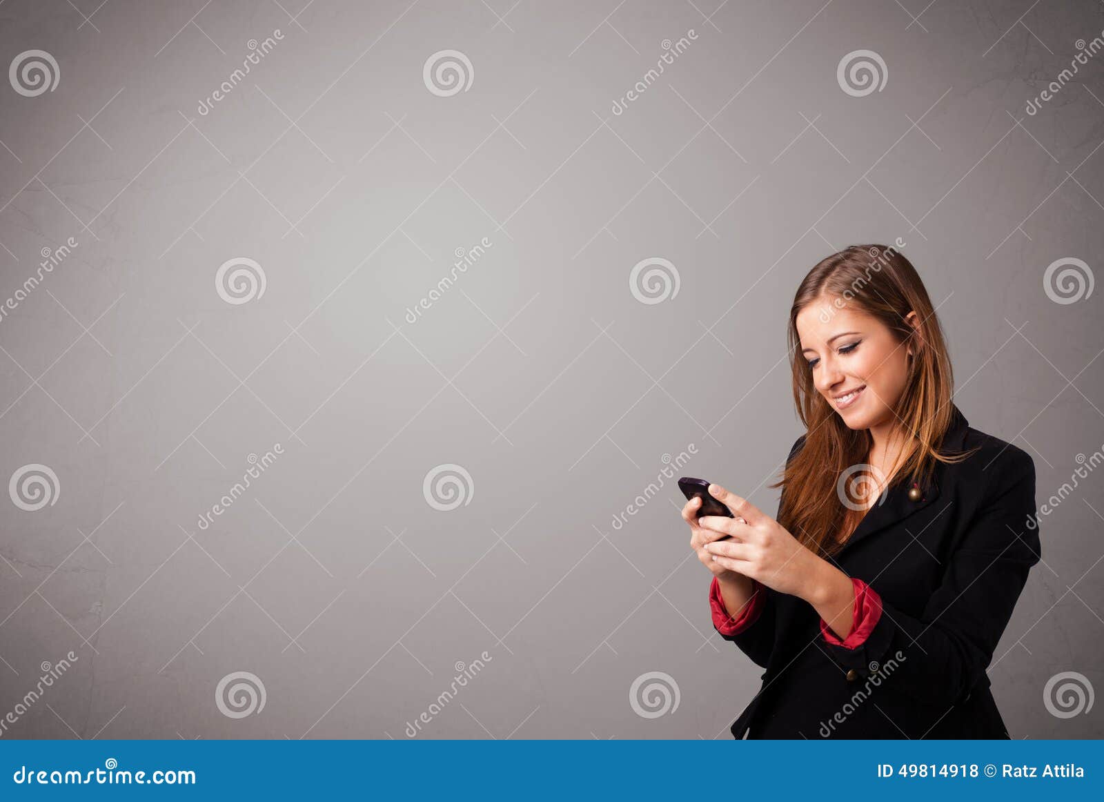 Young Lady Standing and Holding a Phone with Copy Space Stock Photo ...