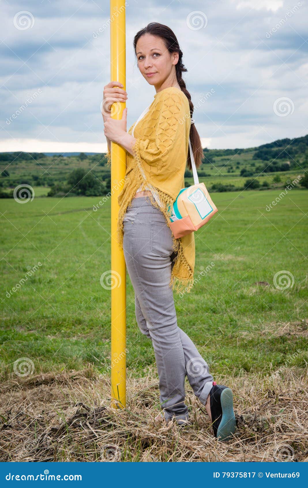 Young Lady Standing by the Pole Stock Image - Image of calm, field ...