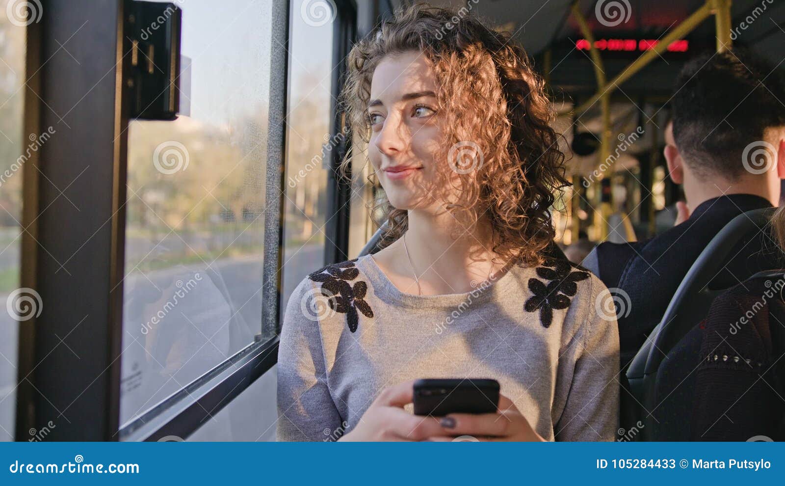 A Young Lady Using a Smartphone on the Bus Stock Image - Image of ...