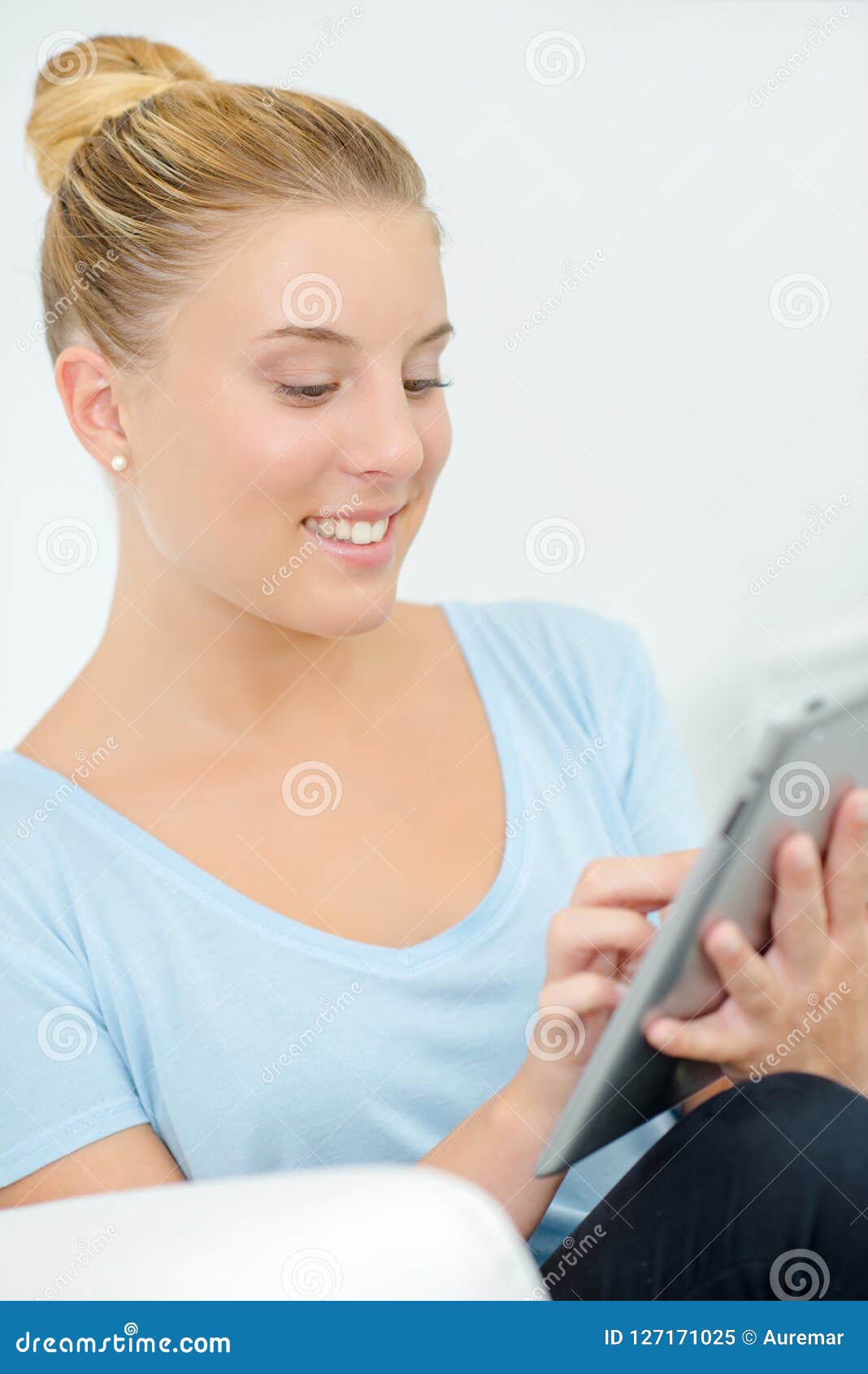 Young lady using tablet stock image. Image of touchscreen - 127171025