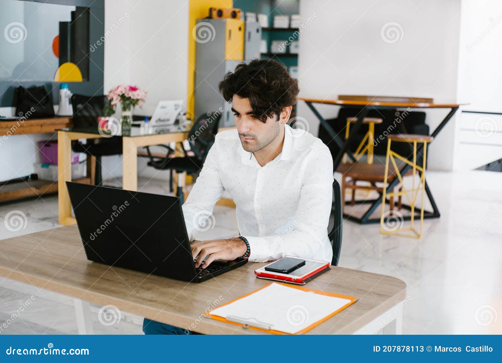 Young Latin American Man Working at Computer at Office in Mexico City ...