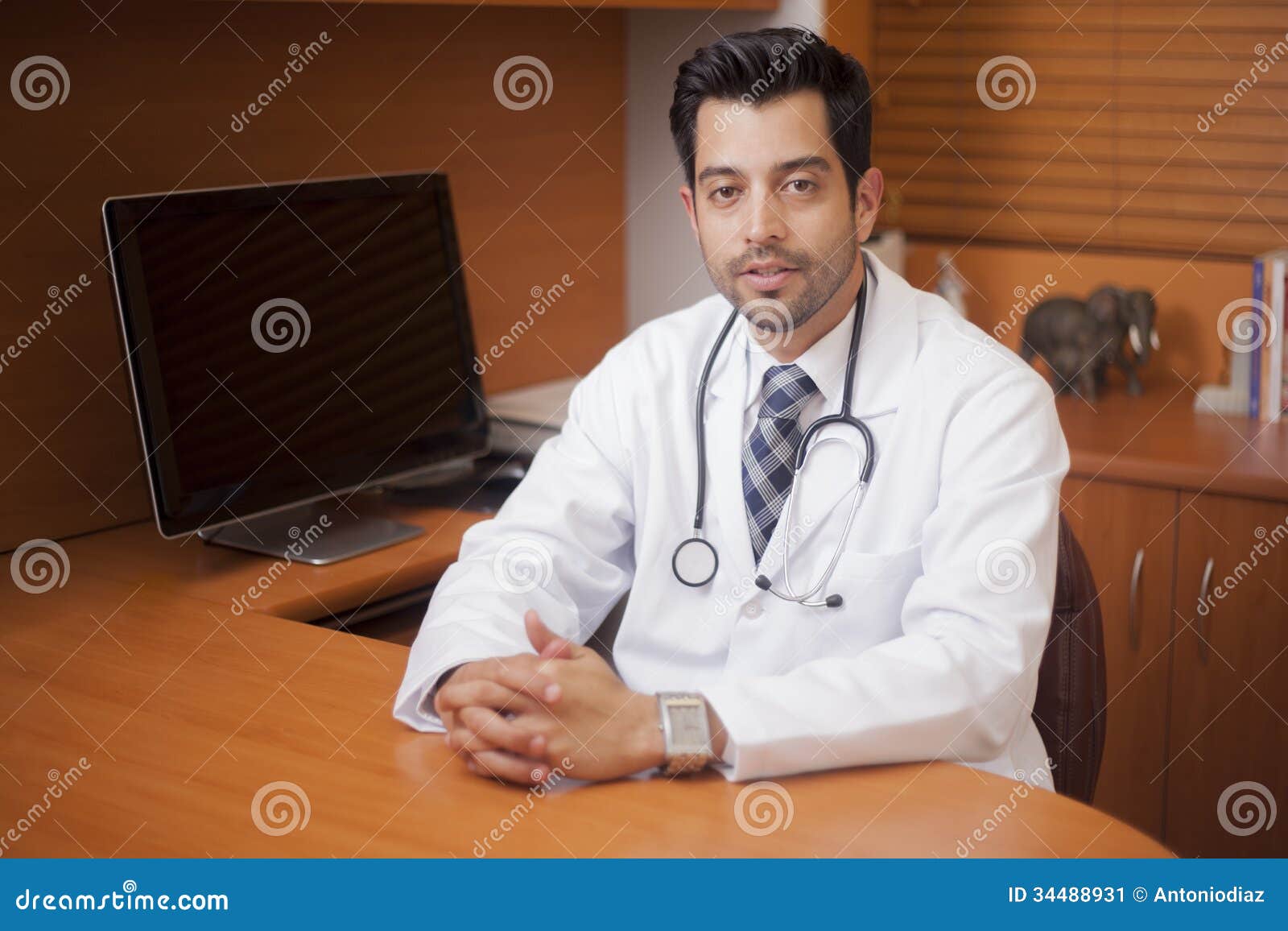 Young latin doctor at work stock image. Image of coat - 34488931