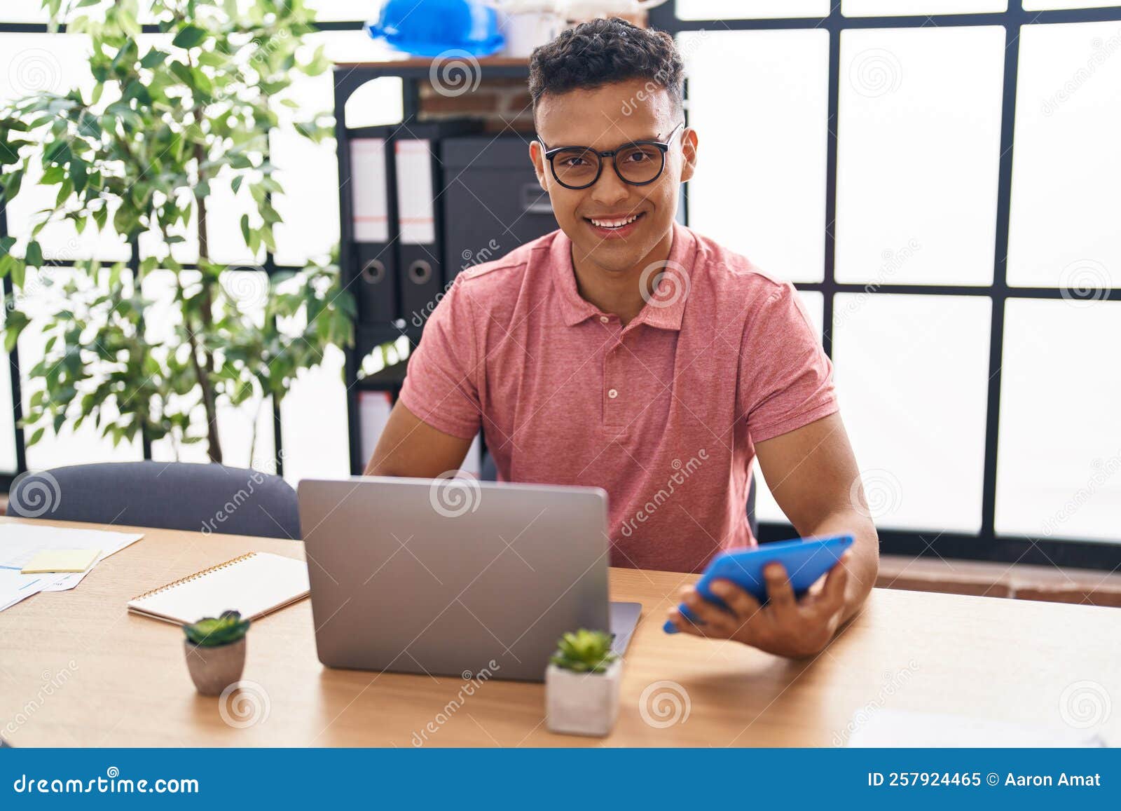 Young Latin Man Business Worker Using Laptop and Touchpad at Office ...