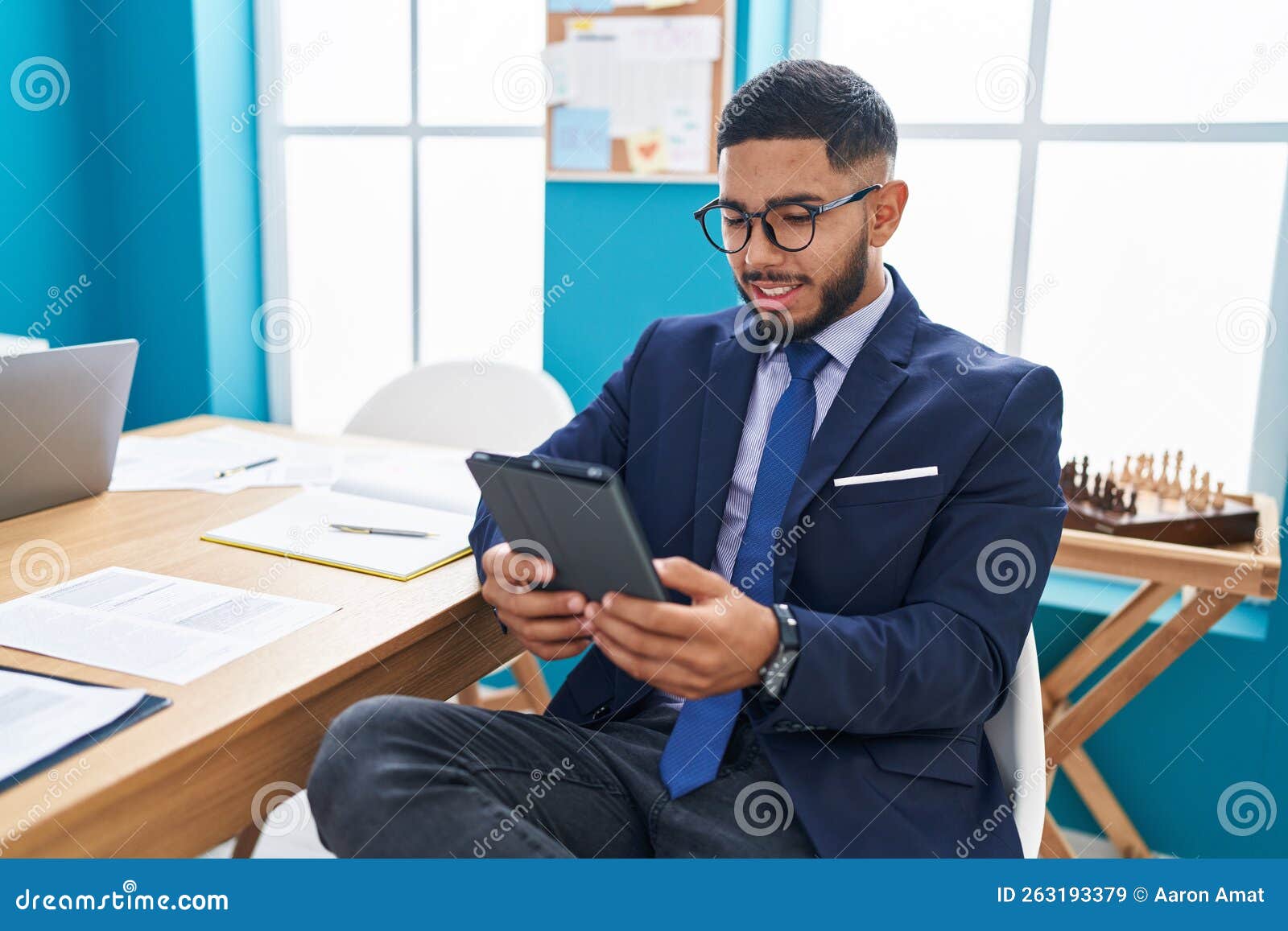 Young Latin Man Business Worker Using Touchpad Working at Office Stock ...