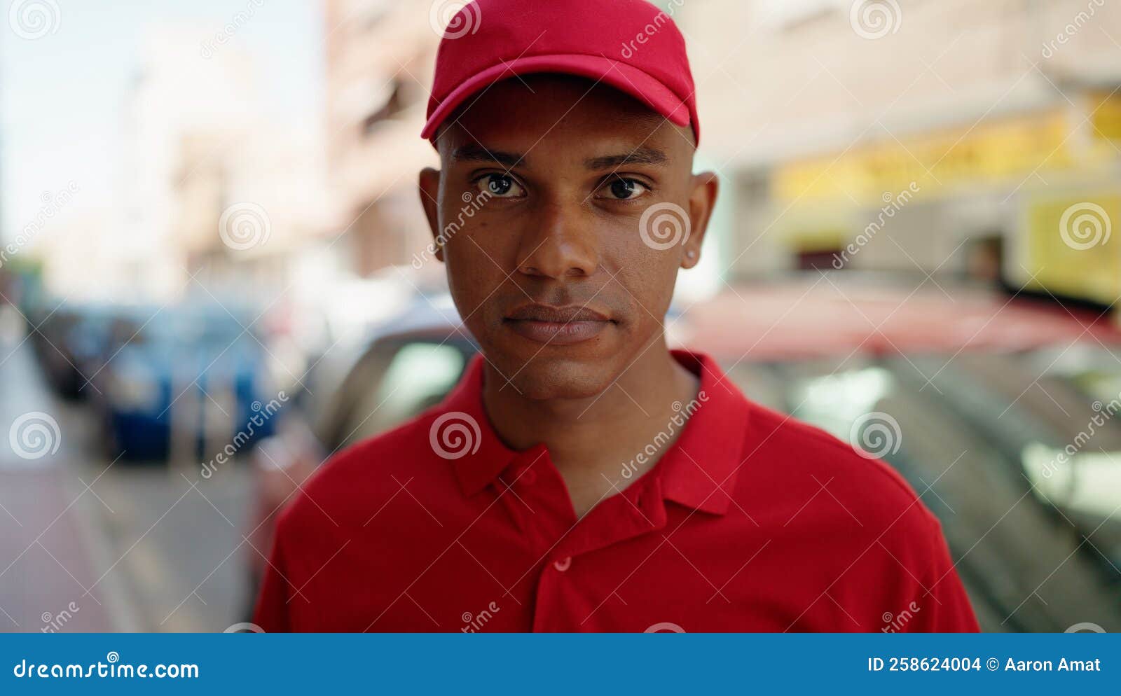 Young Latin Man Delivery Worker with Relaxed Expression Standing at ...