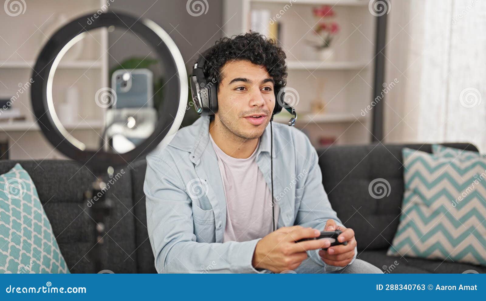 Young Latin Man Gamer Recording Video Tutorial Playing Video Game at ...