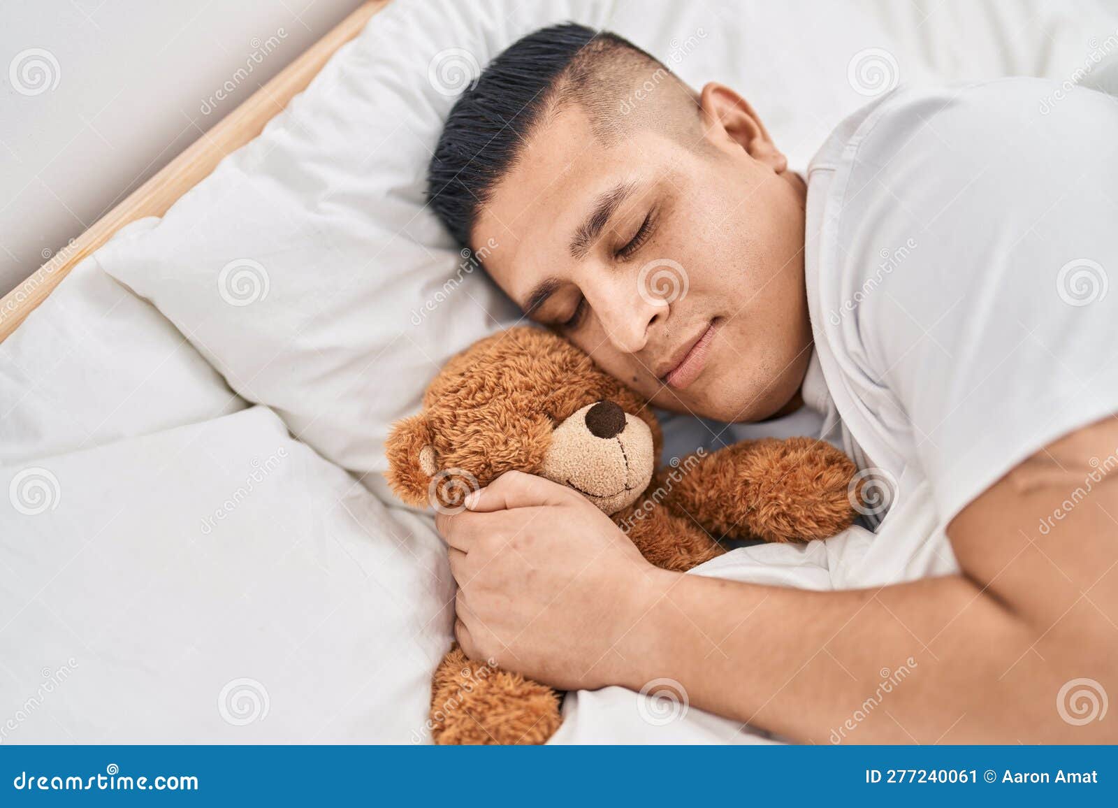 Young Latin Man Hugging Teddy Bear Lying on Bed Sleeping at Bedroom ...