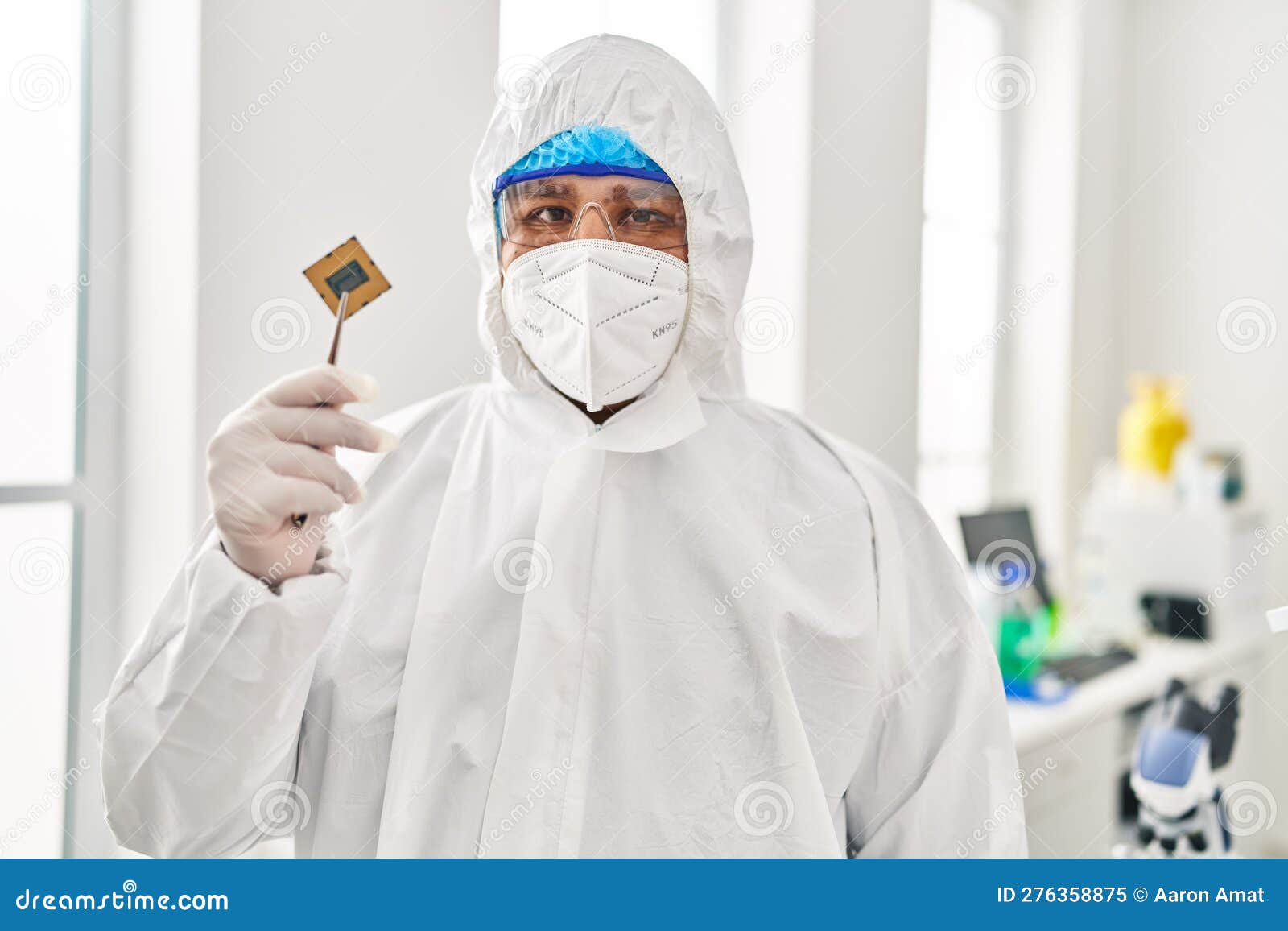 Young Latin Man Scientist Wearing Covid Protection Uniform Holding Cpu ...
