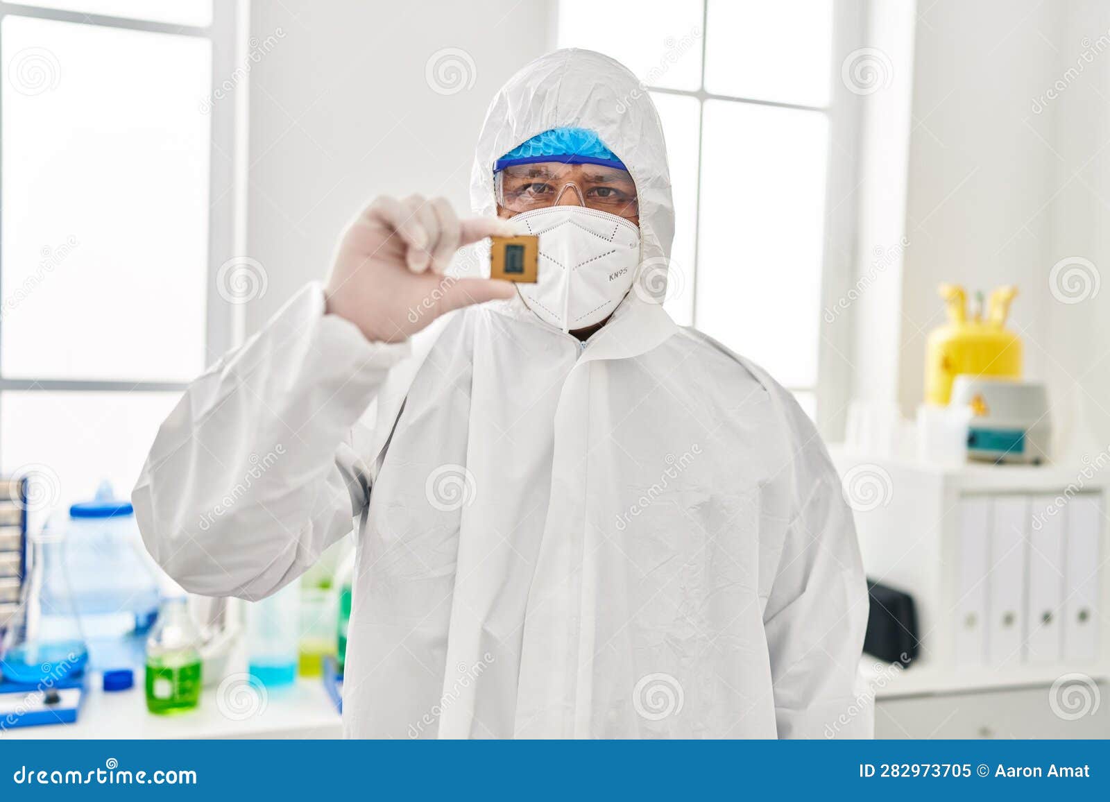 Young Latin Man Scientist Wearing Covid Protection Uniform Holding Cpu ...