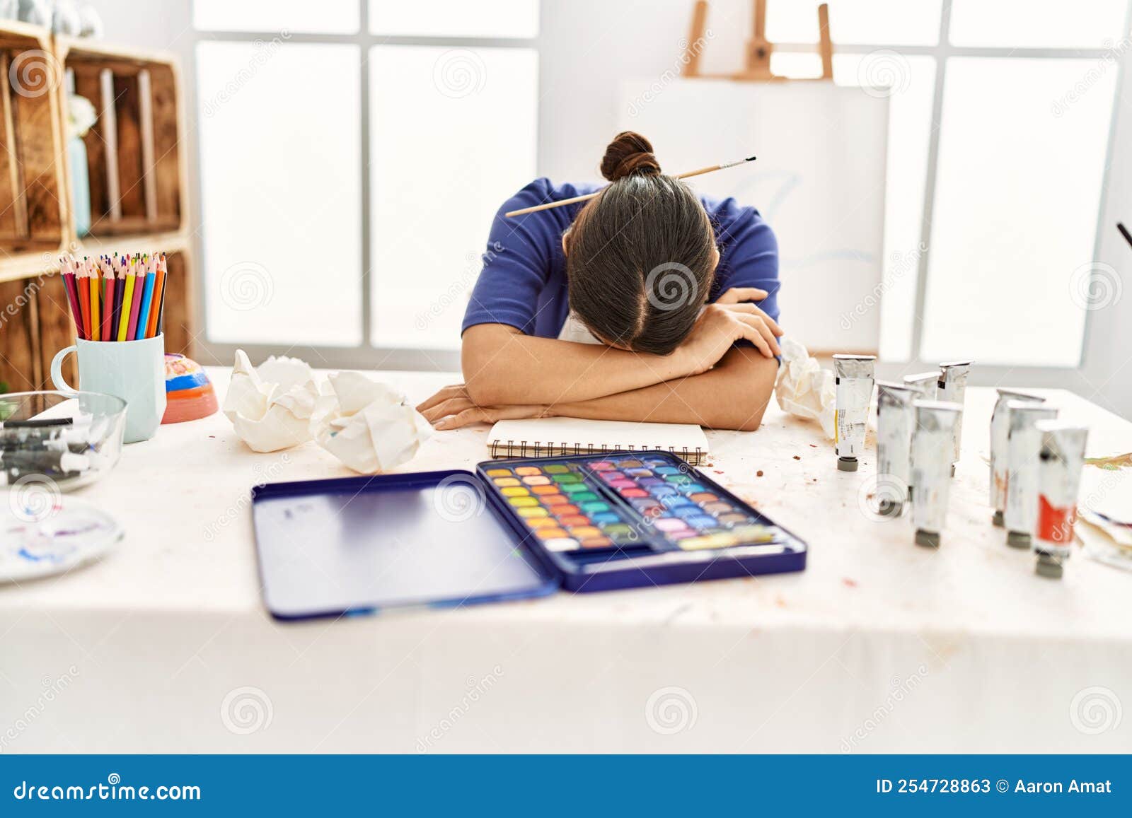 Young Latin Woman Crying Sitting on Table at Art Studio Stock Image ...
