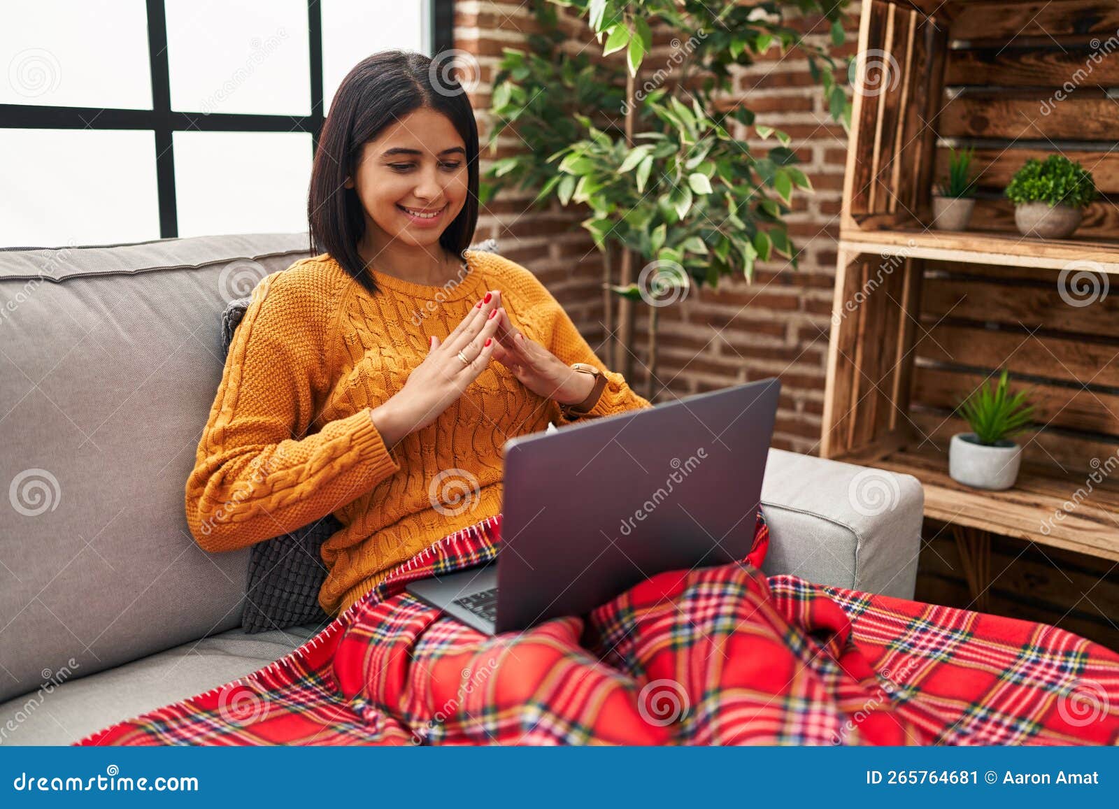 Young Latin Woman Having Video Call Using Deaf Sign Language at Home ...