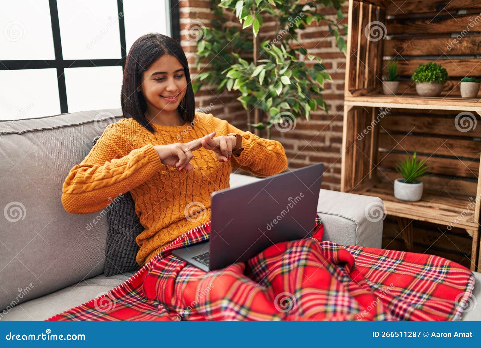 Young Latin Woman Having Video Call Using Deaf Sign Language at Home ...