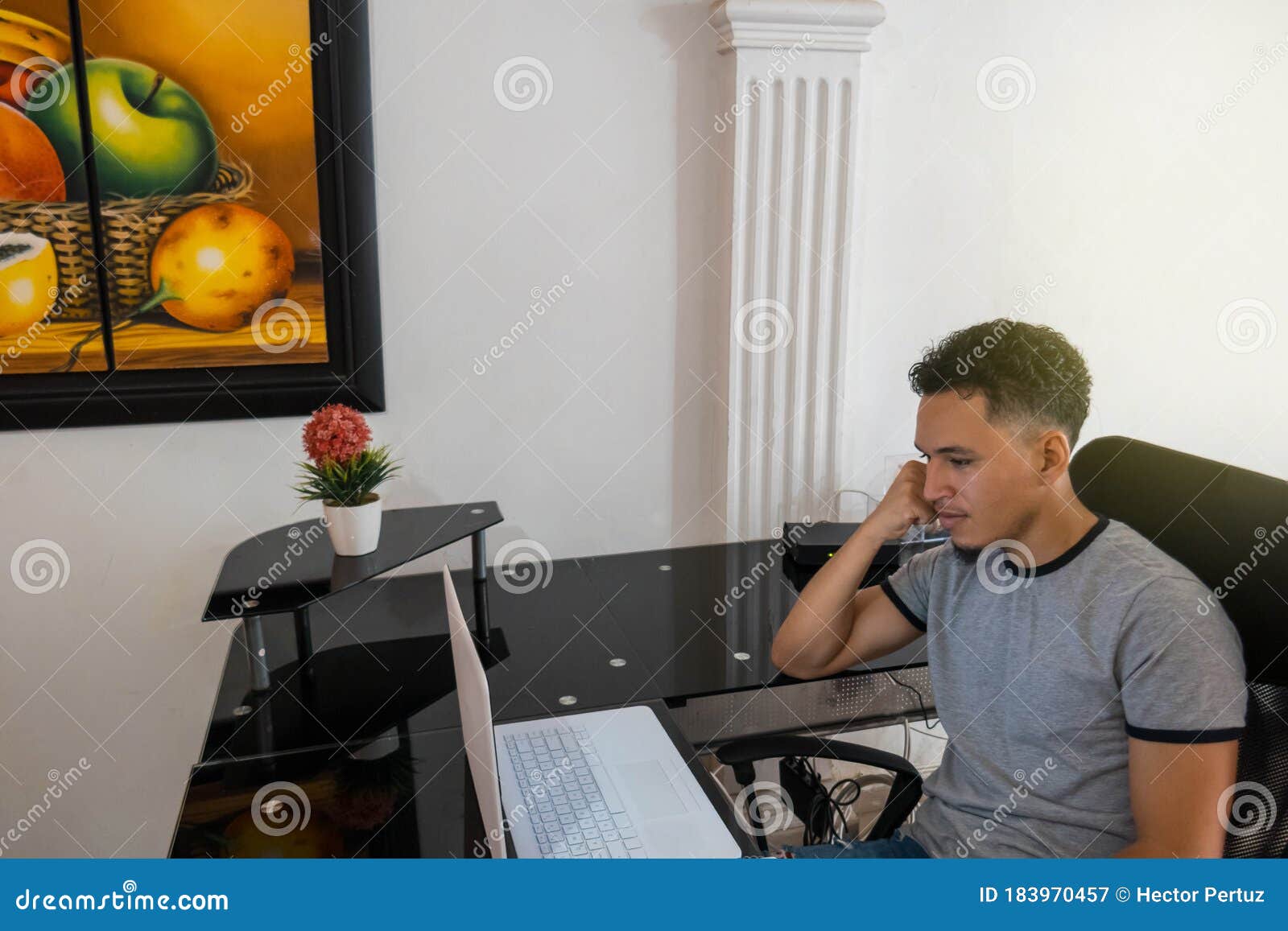 Young Latino Man Uses a Laptop at Home Stock Image - Image of ethnicity ...