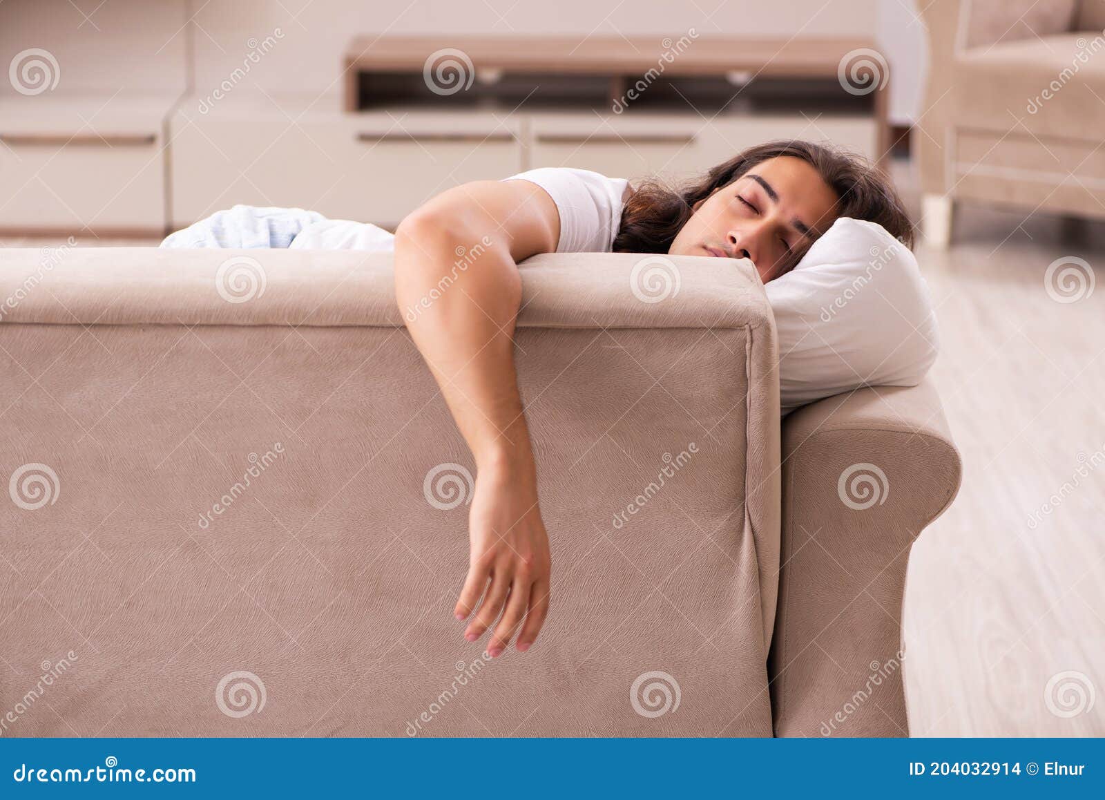 Young Lazy Man in Oversleeping Concept at Home Stock Photo - Image of ...