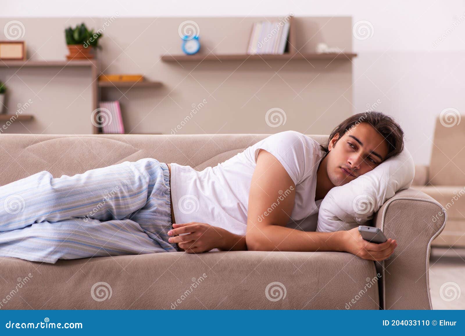 Young Lazy Man in Oversleeping Concept at Home Stock Photo - Image of ...