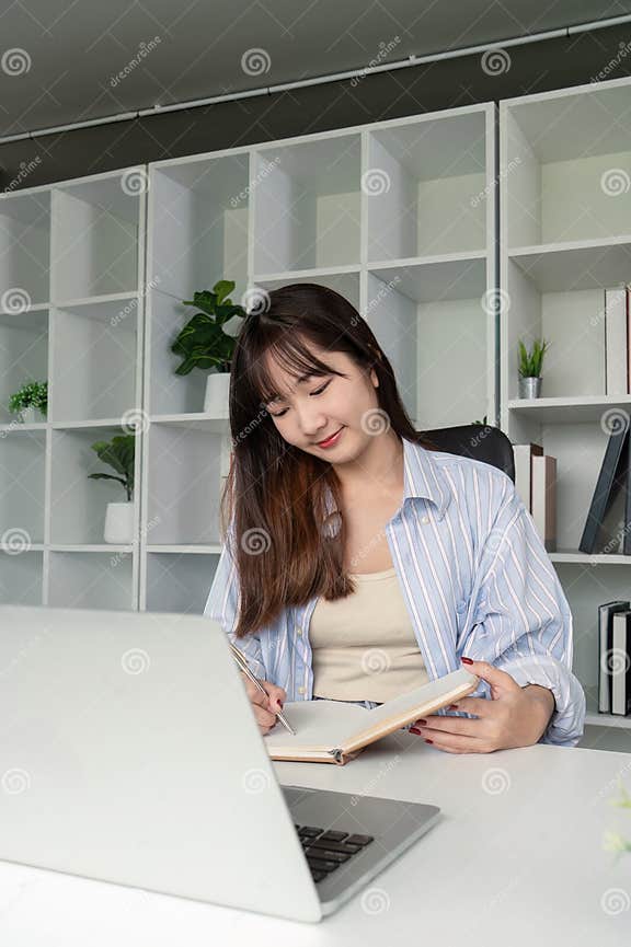 Young Learner Engrossed in Online Learning with Note Taking Stock Photo - Image of discipline ...