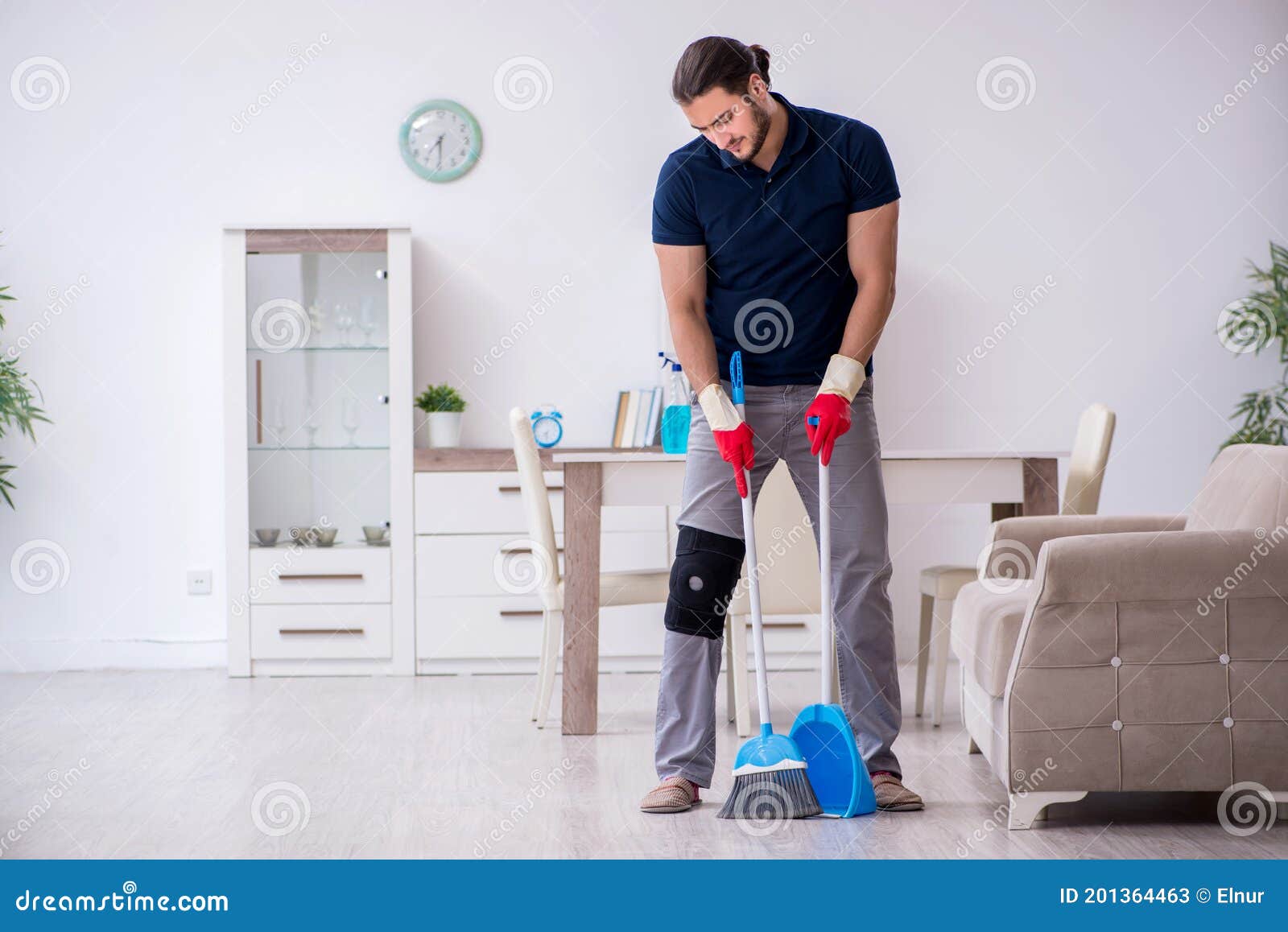 Young Leg Injured Contractor Cleaning the House Stock Image - Image of ...