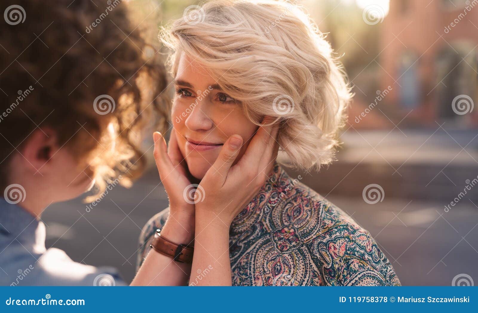 Young Lesbian Couple Looking Affectionately Into Each Other`s Eyes