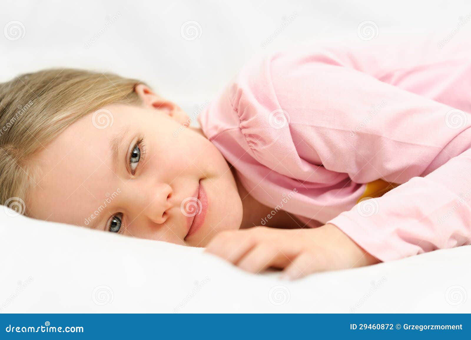 Young Little Girl is Laying on Bed with Peaceful Face Expression Stock ...