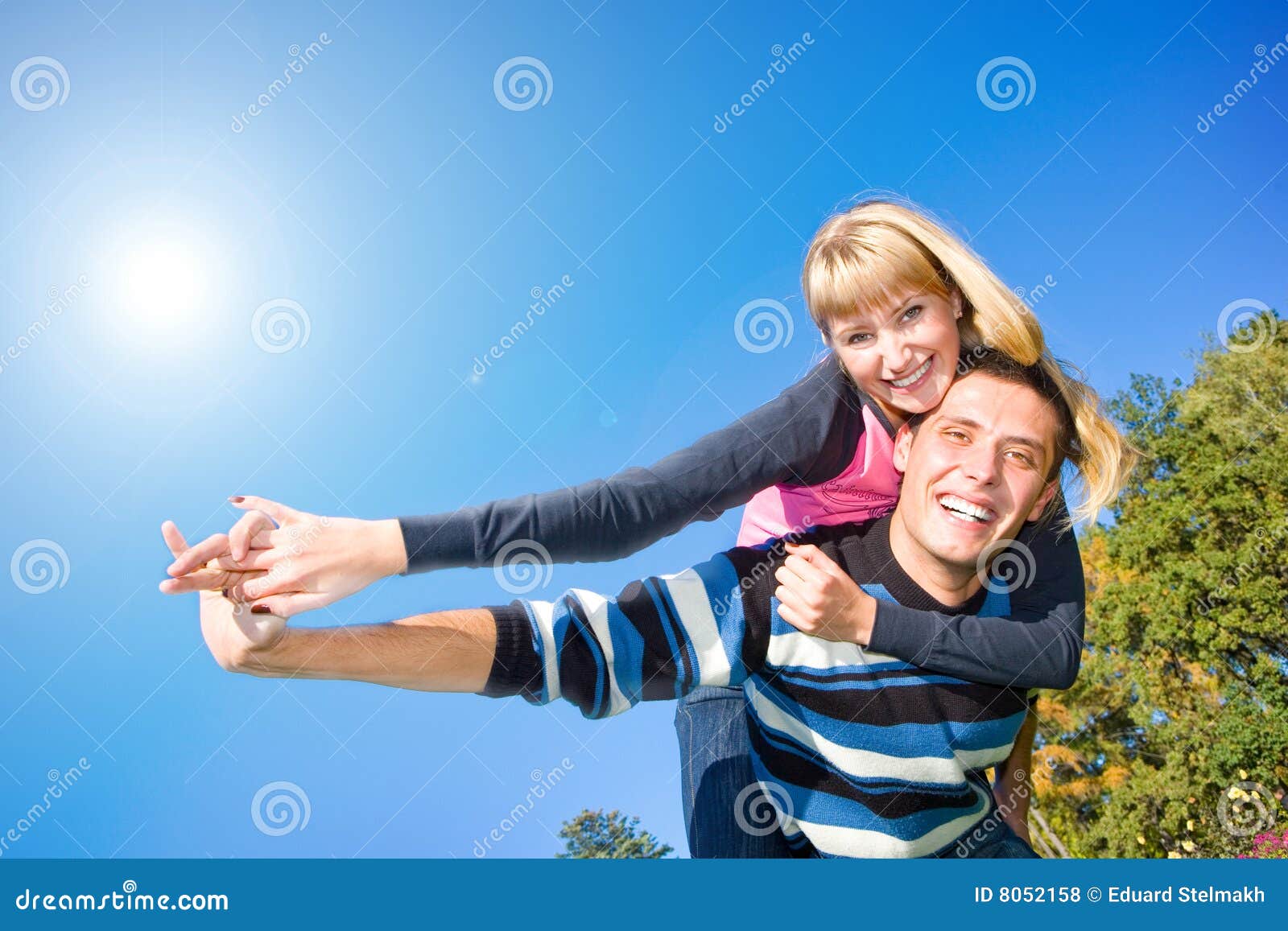Young Love Couple Smiling Under Blue Sky Stock Photo - Image of outdoor ...