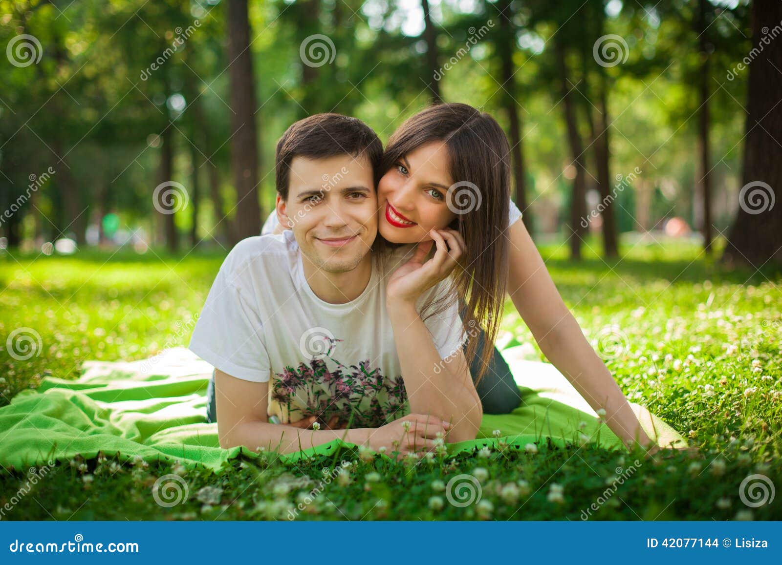 Young Lovers Out in the Park Lying on the Grass Stock Photo - Image of ...