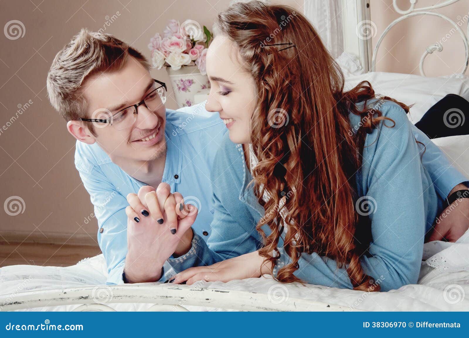 Young Loving Couple in the Bedroom Stock Photo - Image of white ...