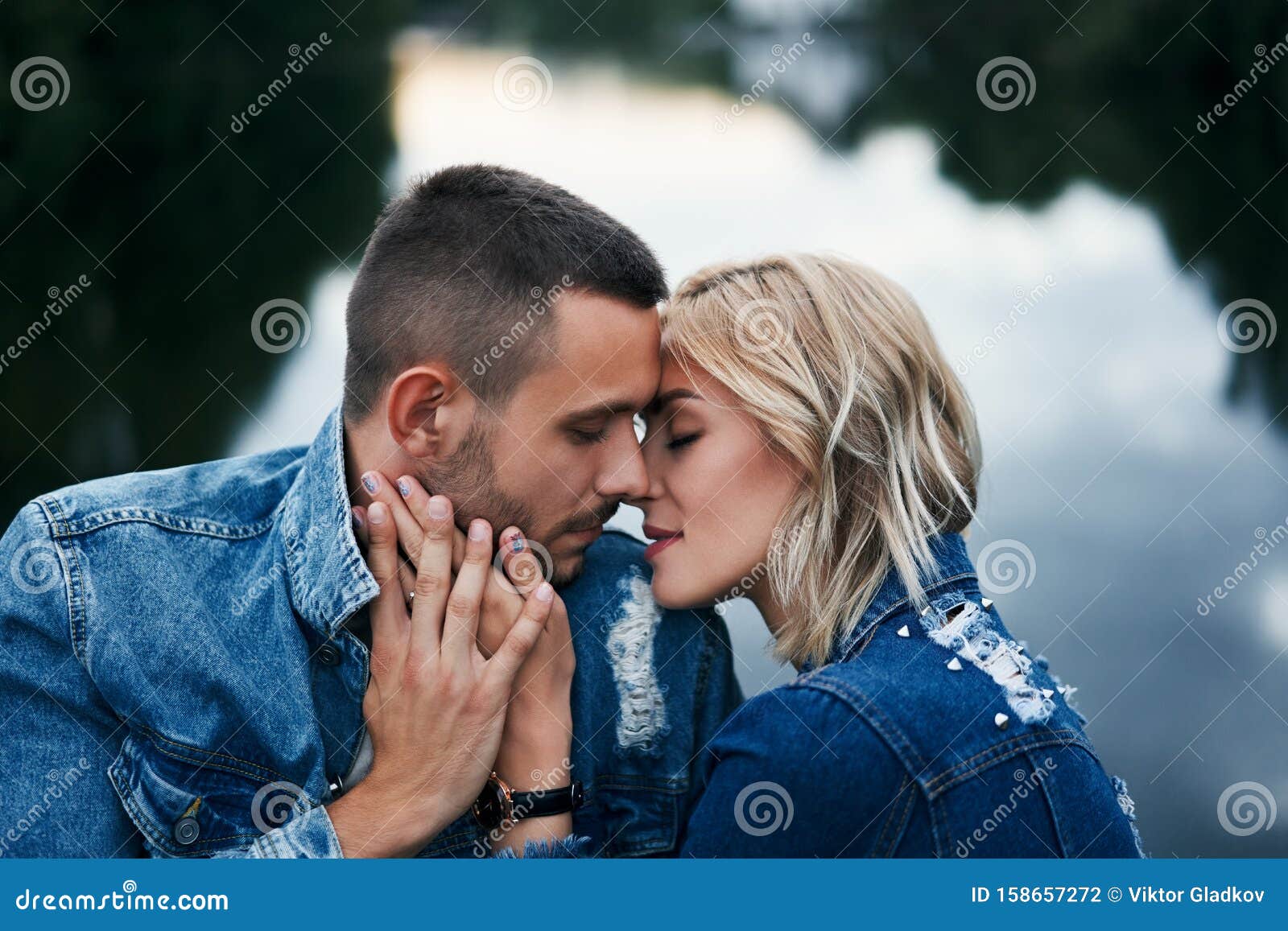 Young Loving Couple Kissing And Enjoying The Company Of Each Other