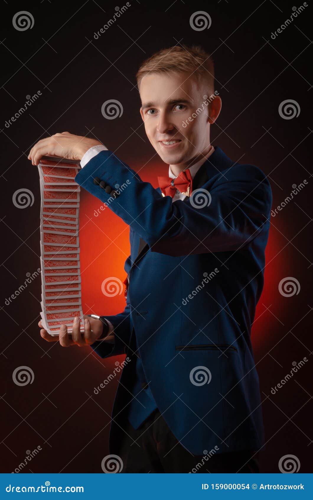 A Young Magician Guy is Holding Cards in His Hands Stock Photo - Image ...