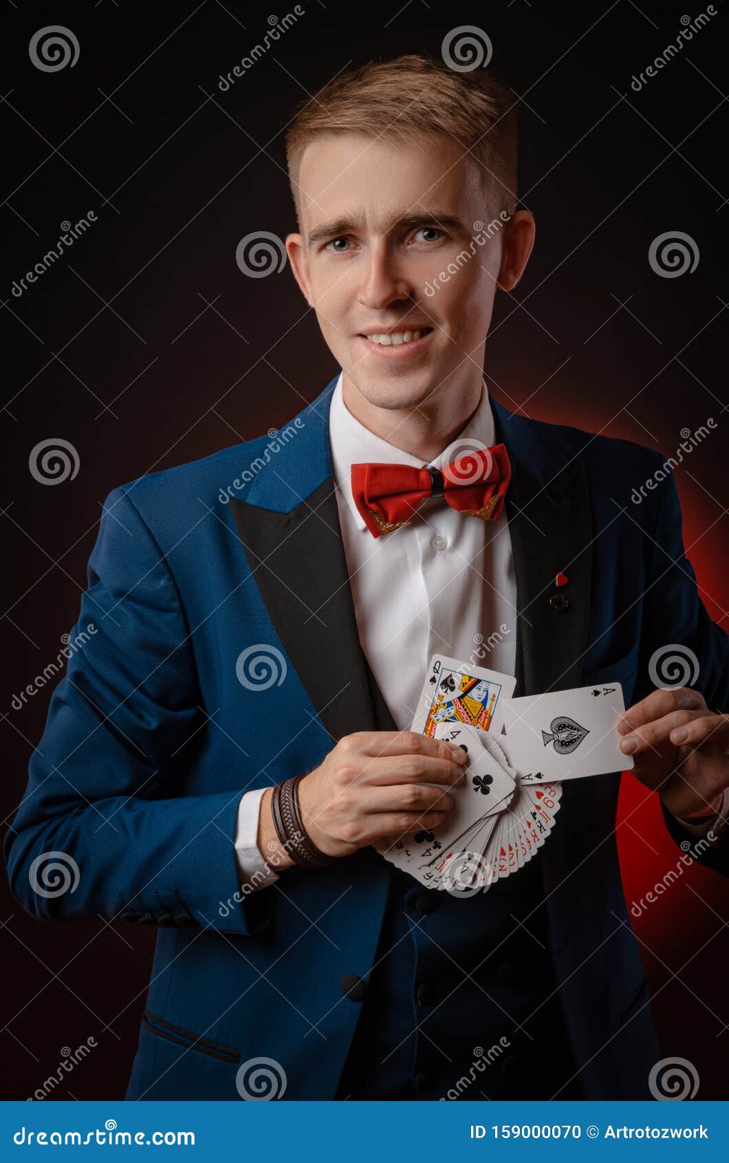 A Young Magician Guy is Holding Cards in His Hands Stock Photo - Image ...