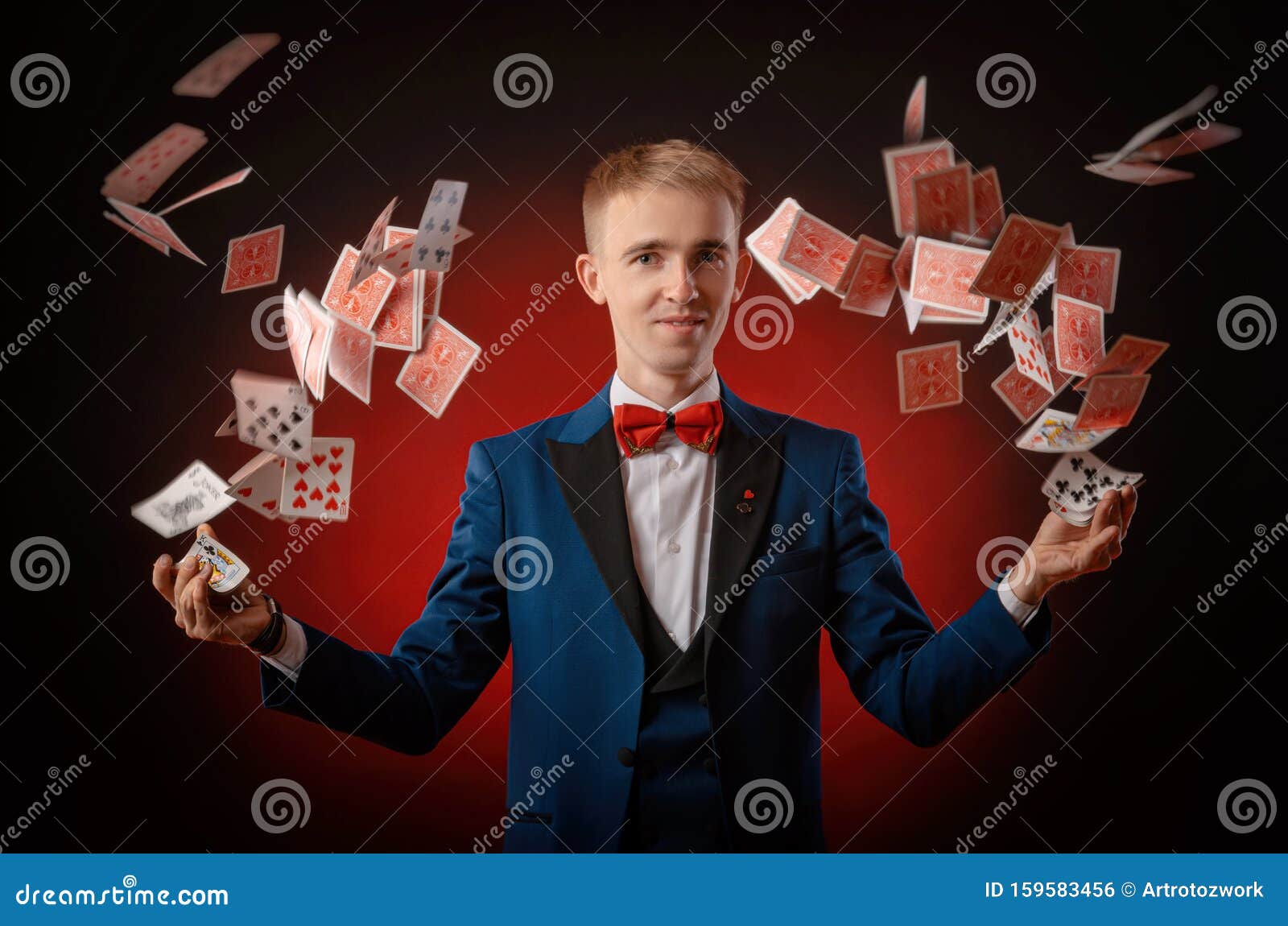 A Young Magician Guy is Holding Cards in His Hands Stock Photo - Image ...