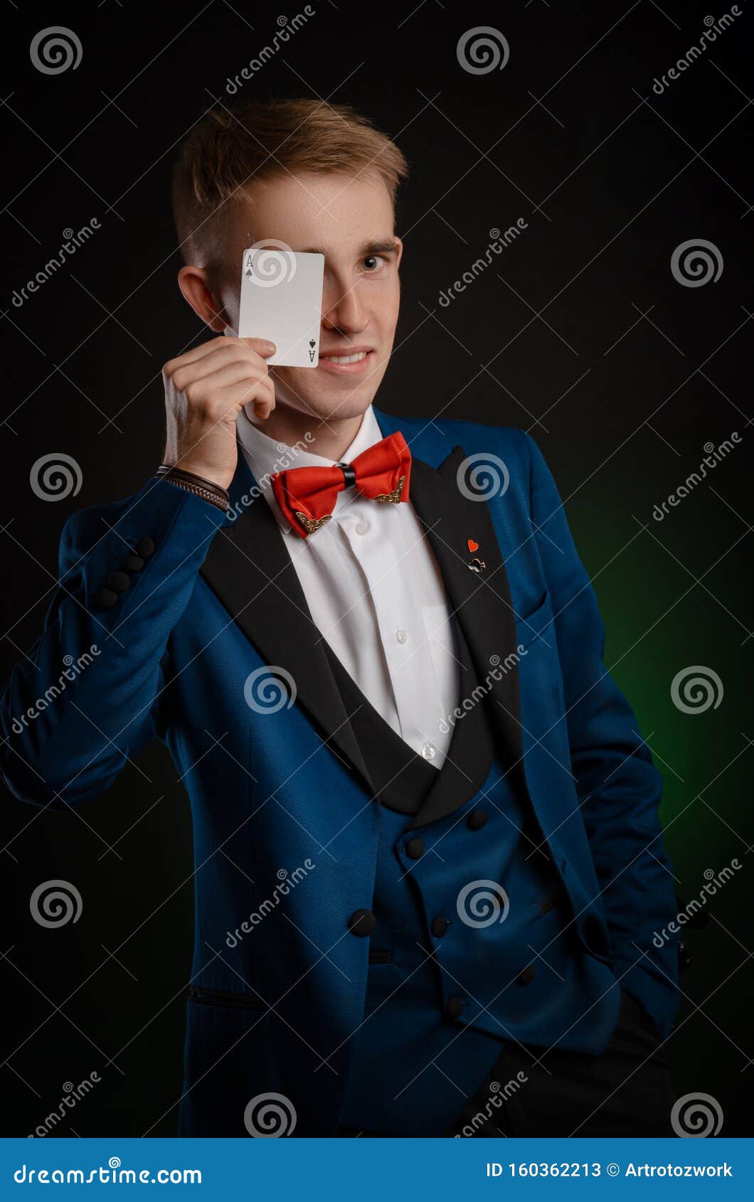 A Young Magician Guy is Holding Cards in His Hands Stock Image - Image ...