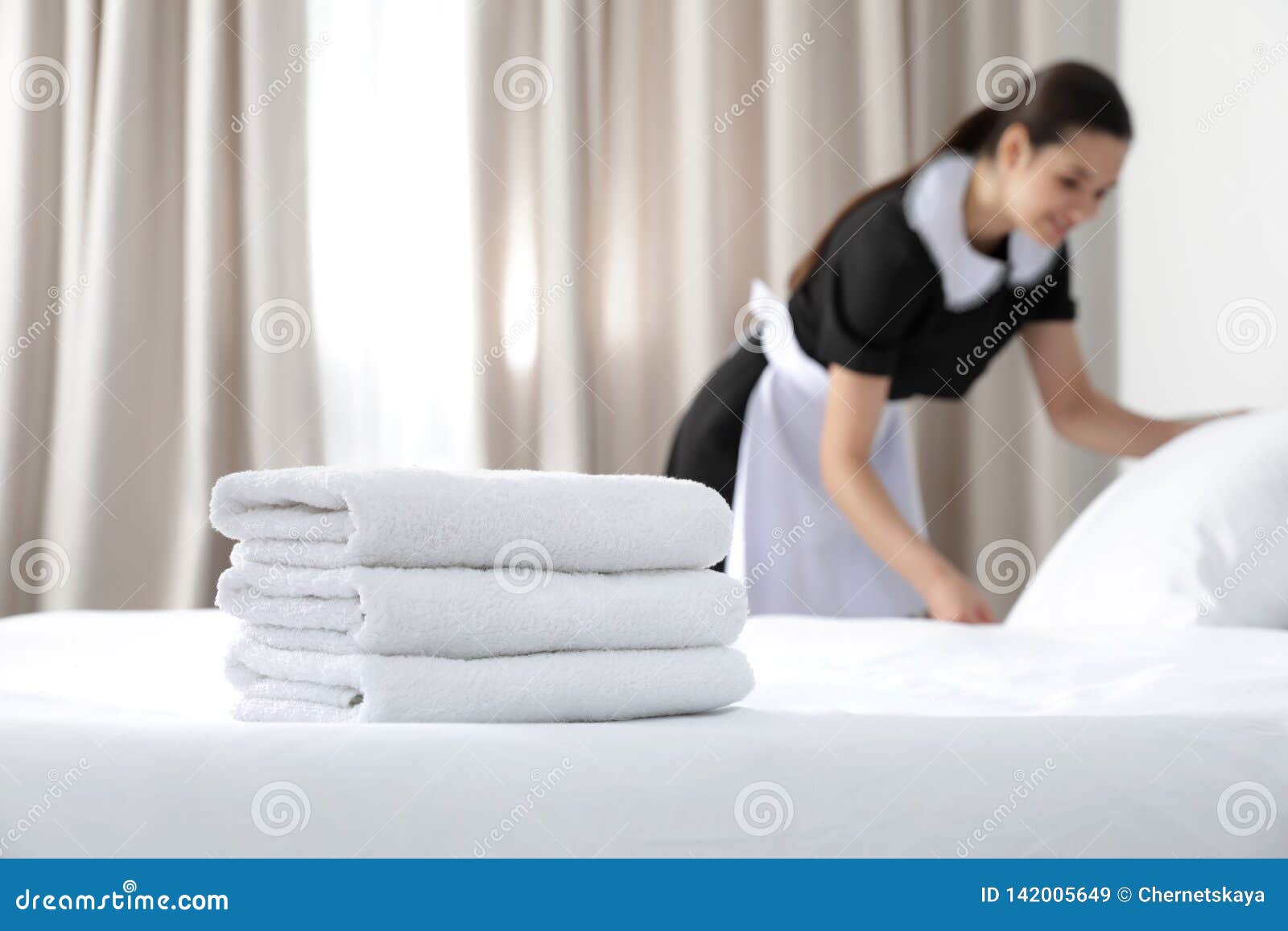 Young Maid Making Bed In Hotel Room Focus On Stack Stock Image Image