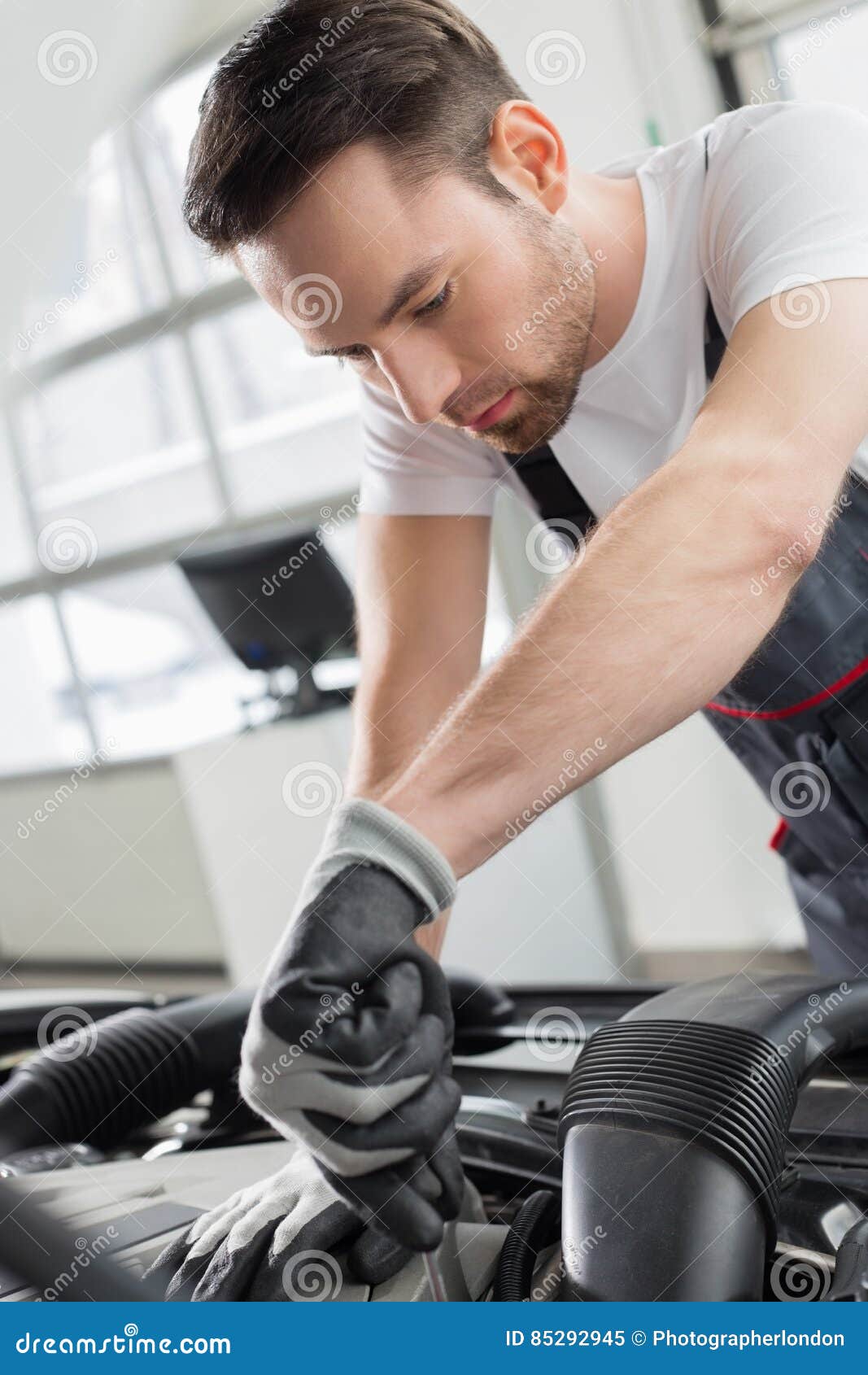 Young Maintenance Engineer Repairing Car in Automobile Store Stock ...