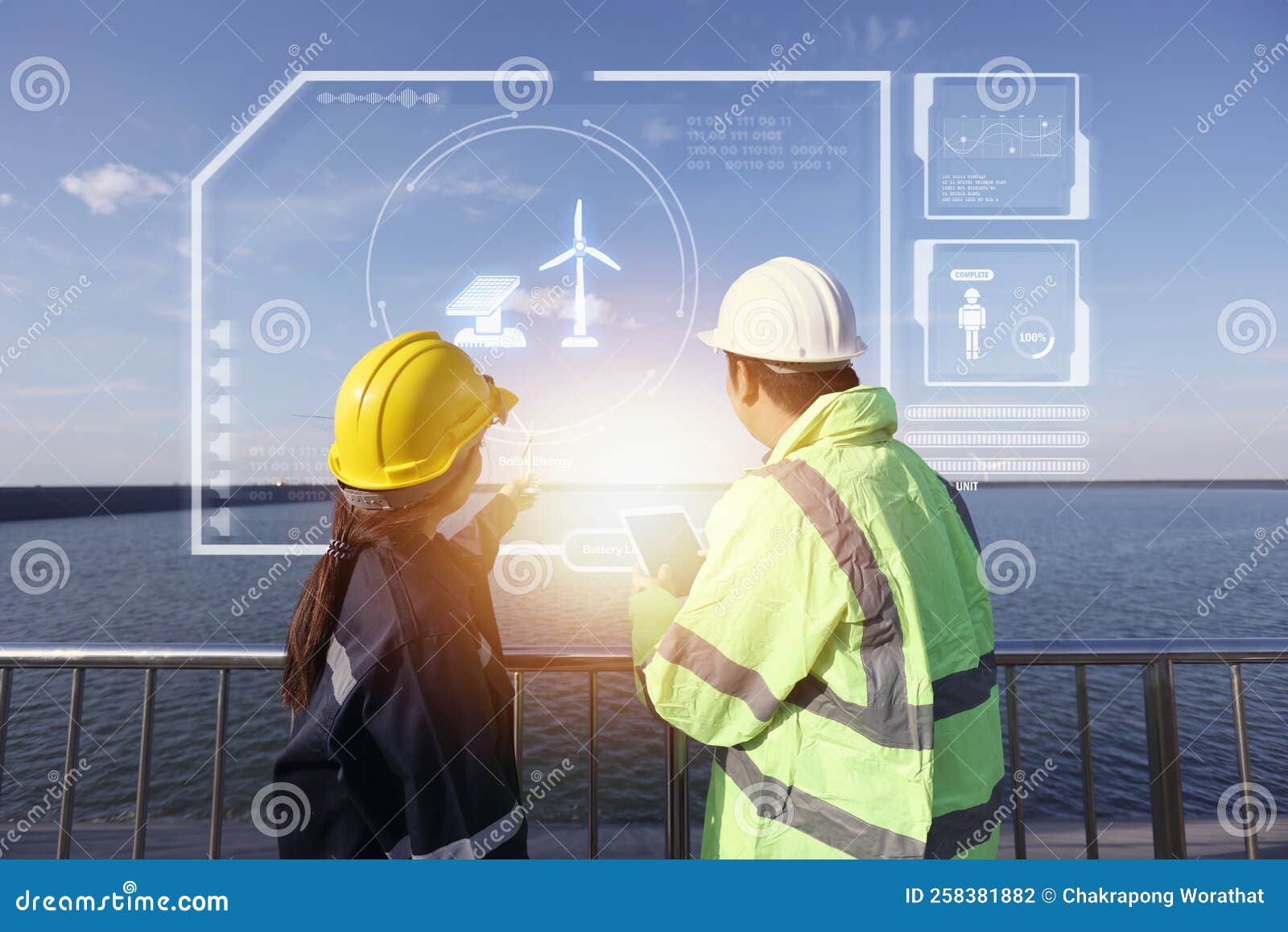 Young Maintenance Engineer Team Working in Wind Turbine Farm at Sunset ...