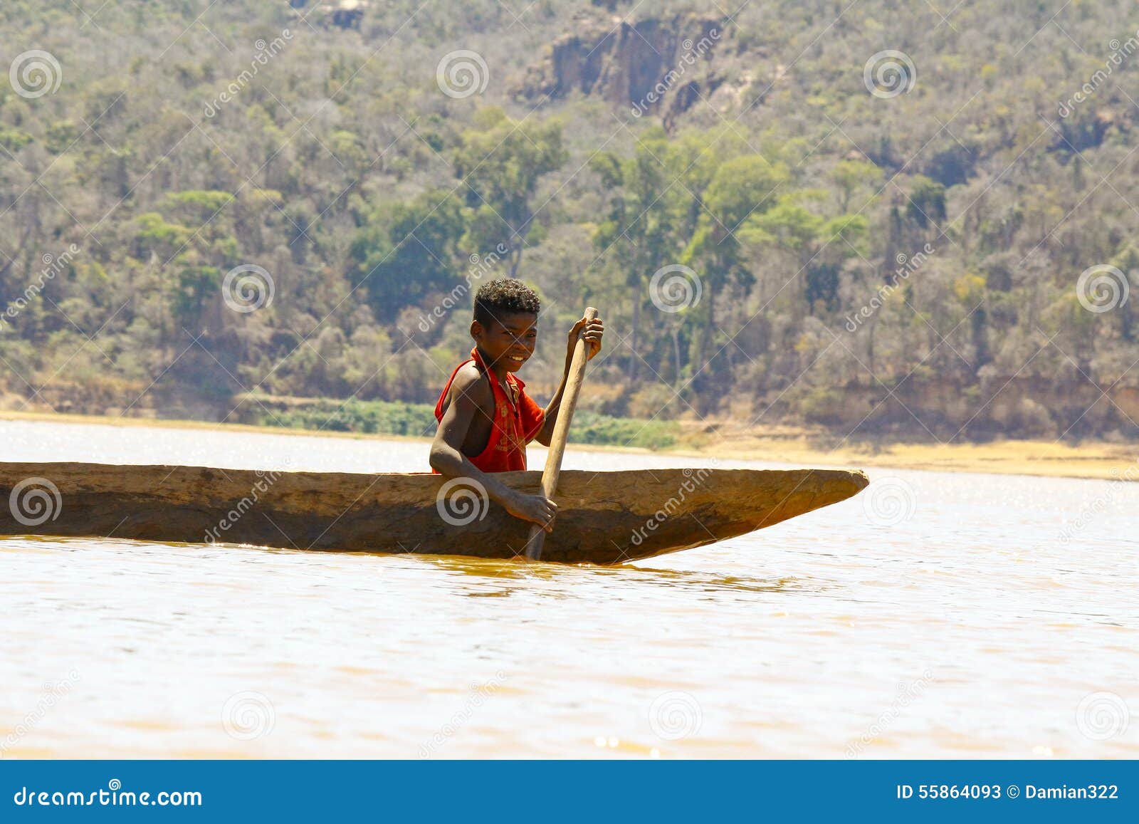 Young Malagasy African Boy Rowing Traditional Canoe Stock Image - Image ...