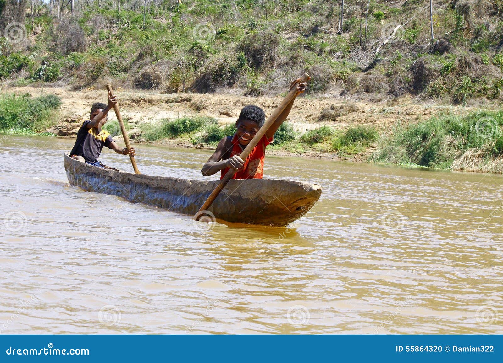 Young Malagasy African Boy Rowing Traditional Canoe Stock Photo - Image ...