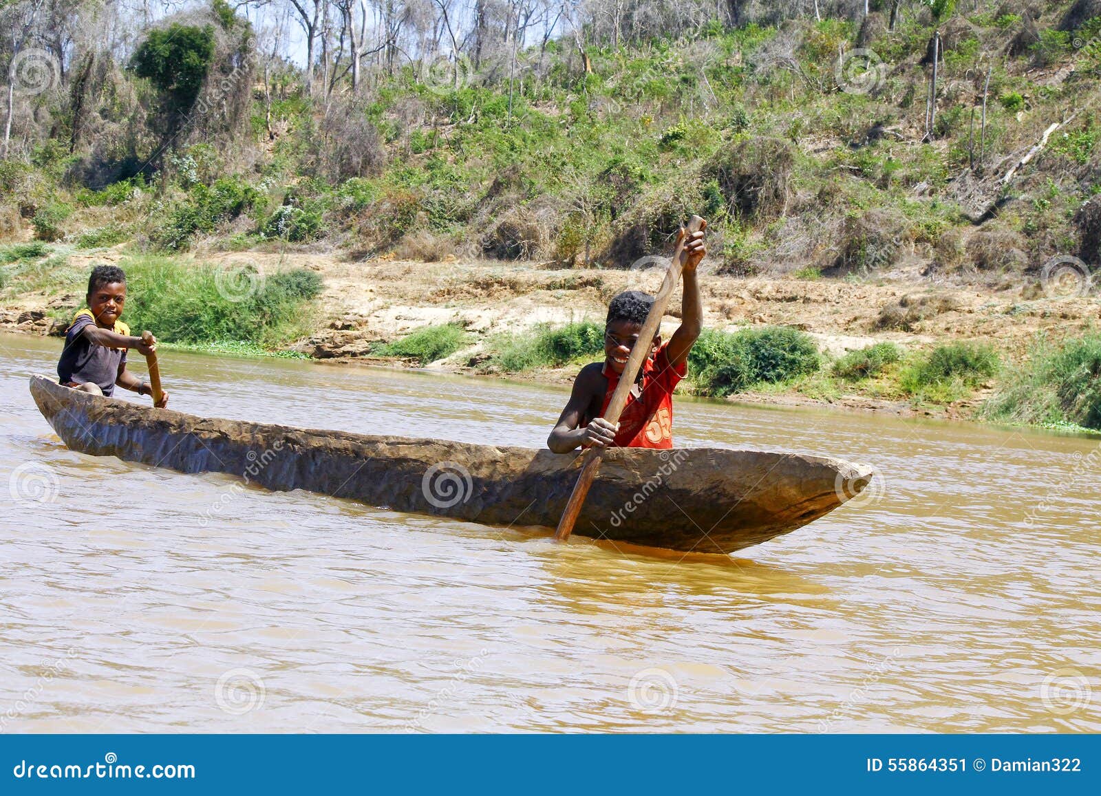 Young Malagasy African Boy Rowing Traditional Canoe Stock Image - Image ...