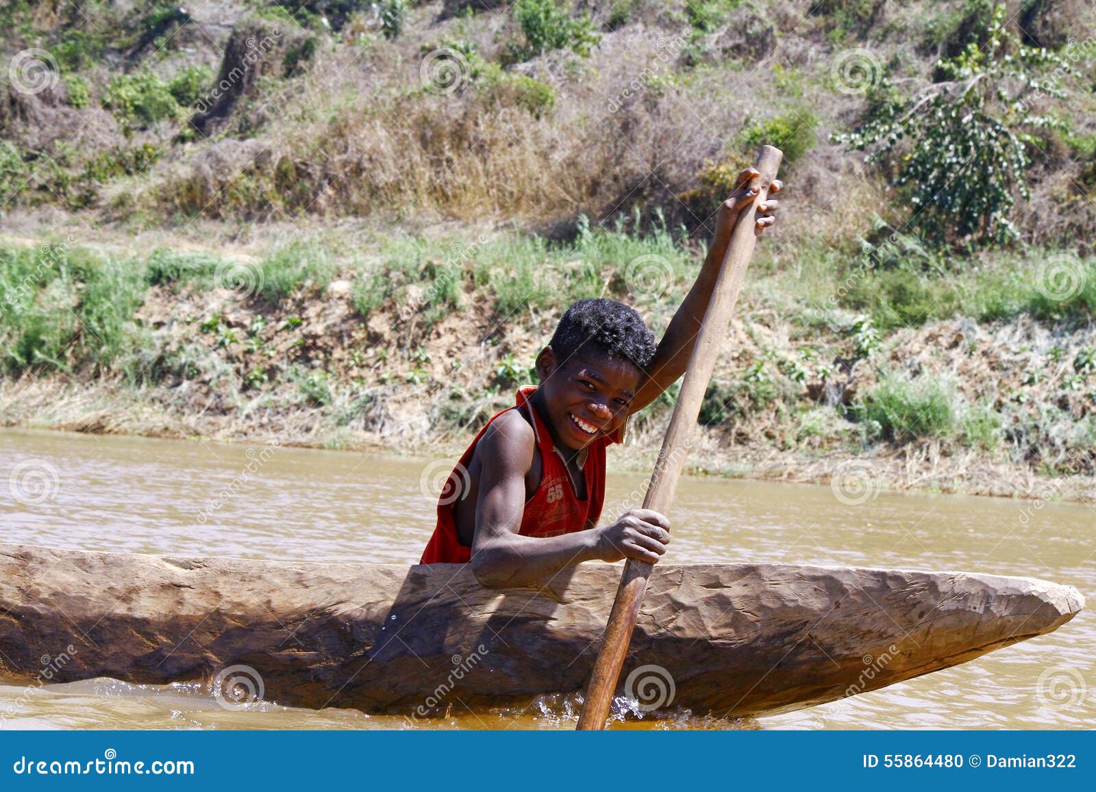 Young Malagasy African Boy Rowing Traditional Canoe Stock Photo - Image ...