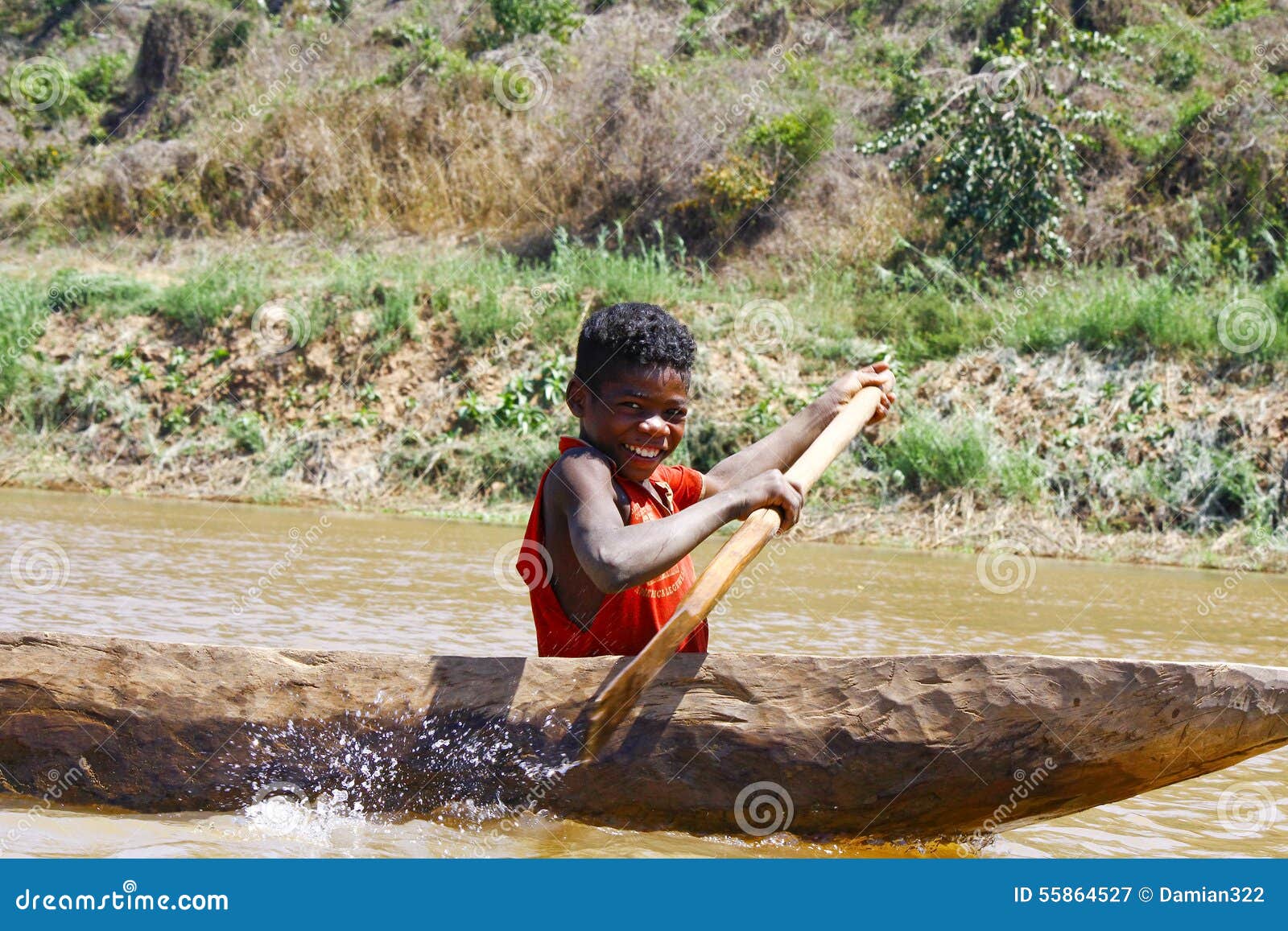 Young Malagasy African Boy Rowing Traditional Canoe Stock Image - Image ...