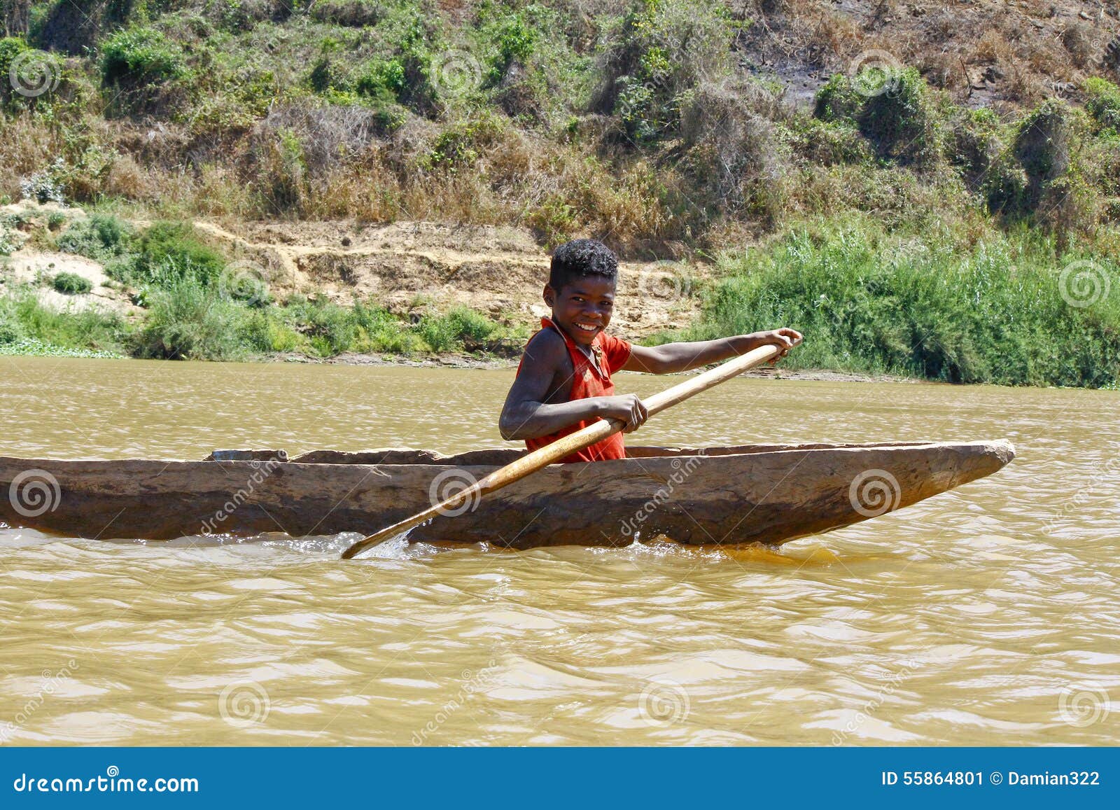 Young Malagasy African Boy Rowing Traditional Canoe Stock Image - Image ...