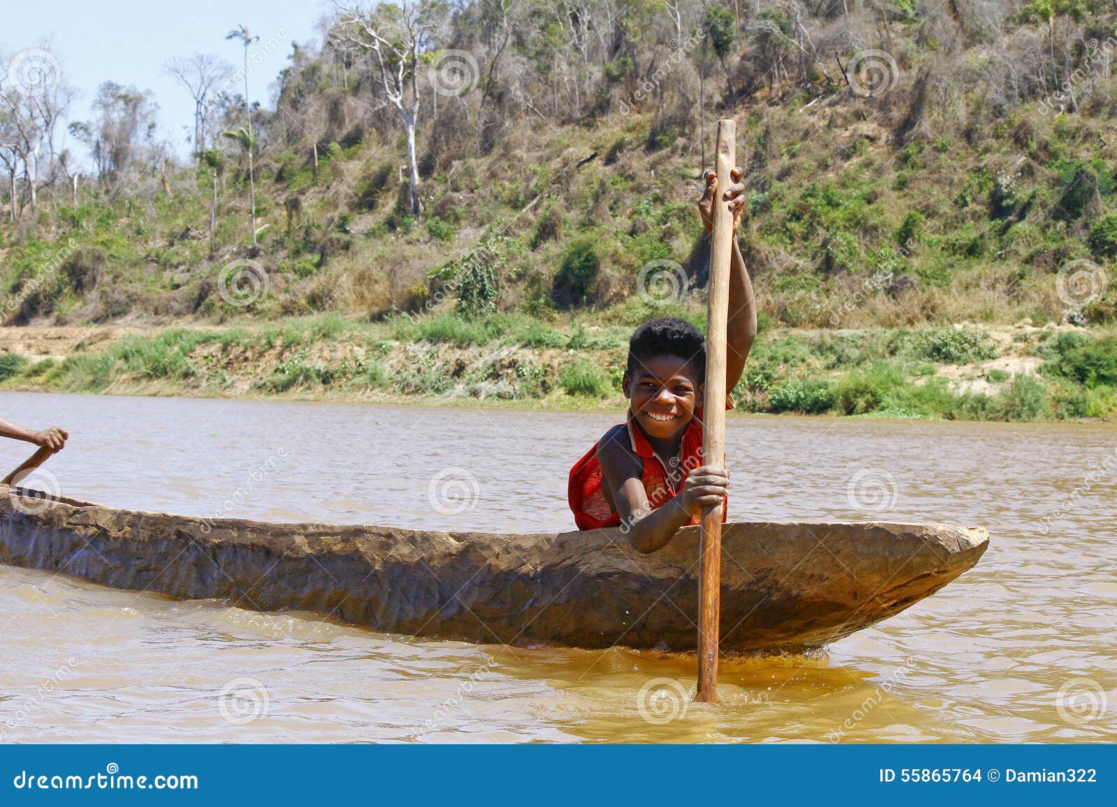 Young Malagasy African Boy Rowing Traditional Canoe Stock Photo - Image ...