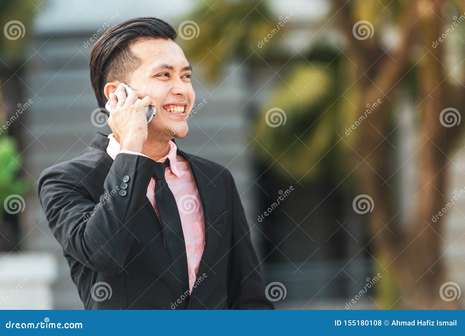 Young Malay Business Man Talking on His Smartphone Stock Photo - Image ...
