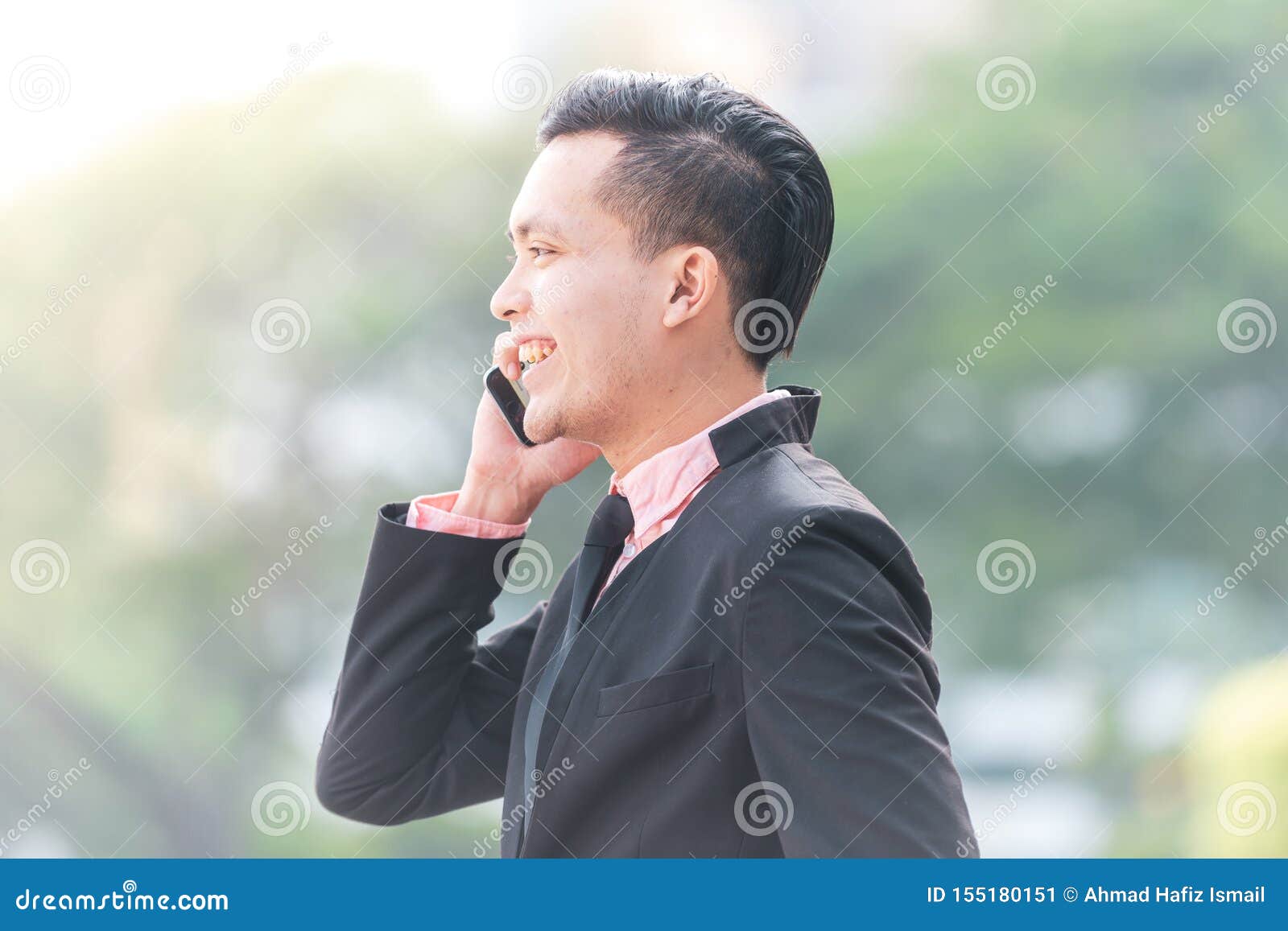 Young Malay Business Man Talking on His Smartphone Stock Image - Image ...