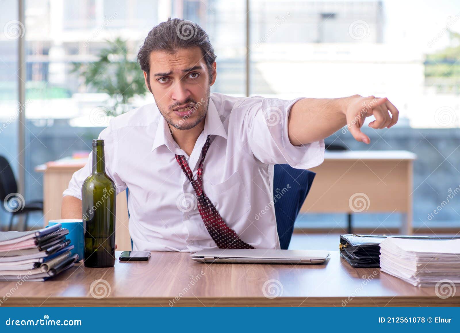 Young Male Alcohol Addicted Employee Working in the Office Stock Photo ...